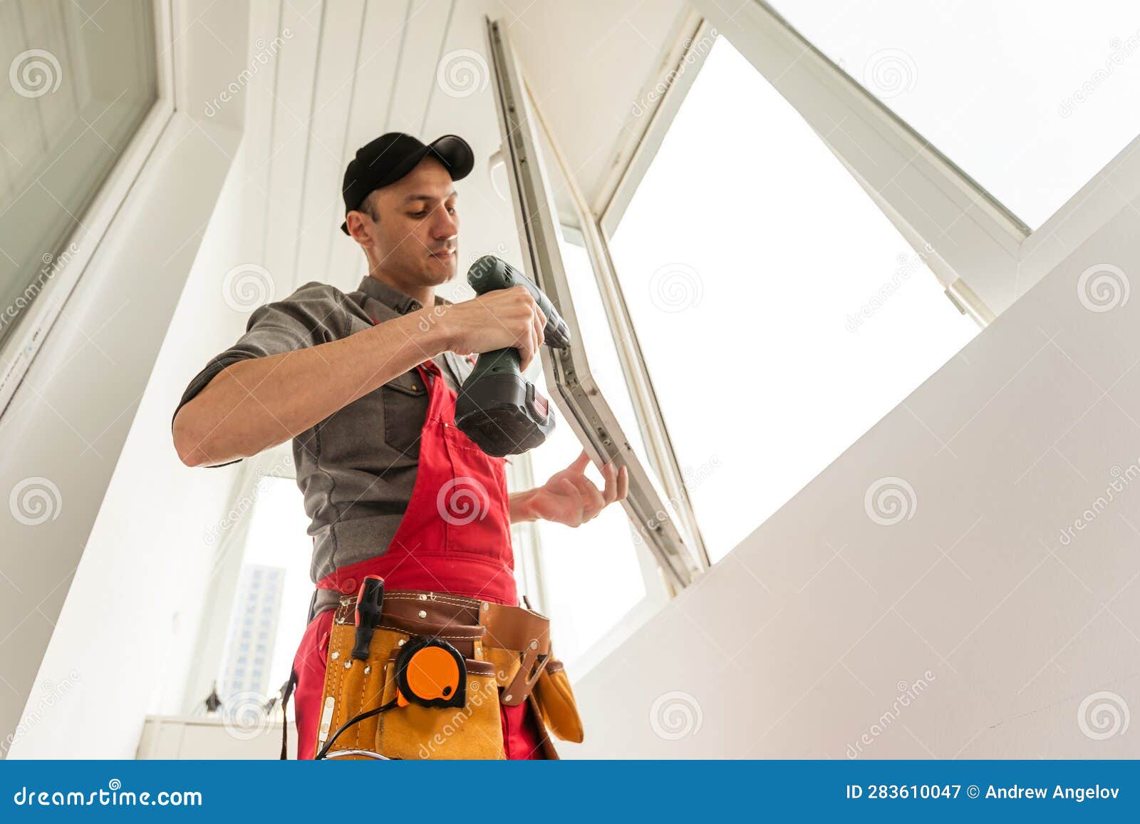 The Foreman Installs a Window Frame in the Room Stock Image - Image of ...