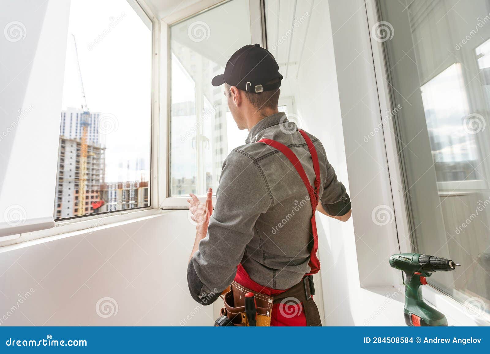 The Foreman Installs a Window Frame in the Room Stock Photo - Image of ...