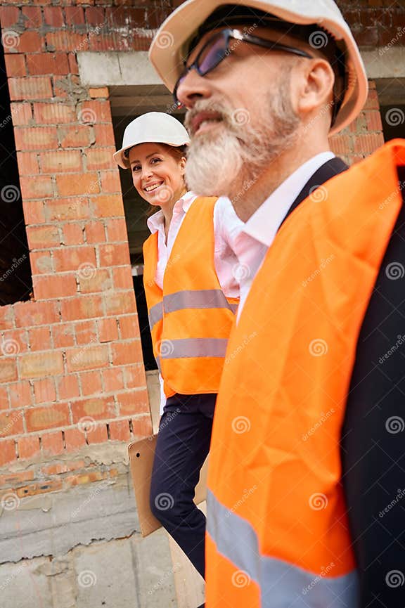 Foreman and Site Manager Conducting Construction Supervision Stock ...