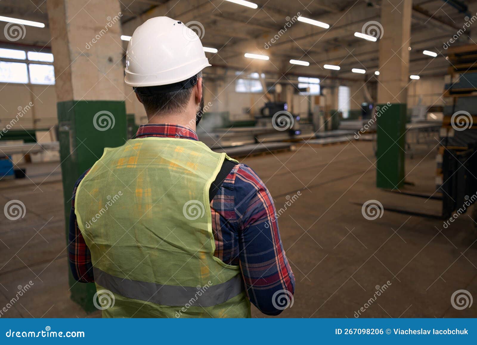 Foreman Supervises Work in the Shop, Back View Stock Photo - Image of ...