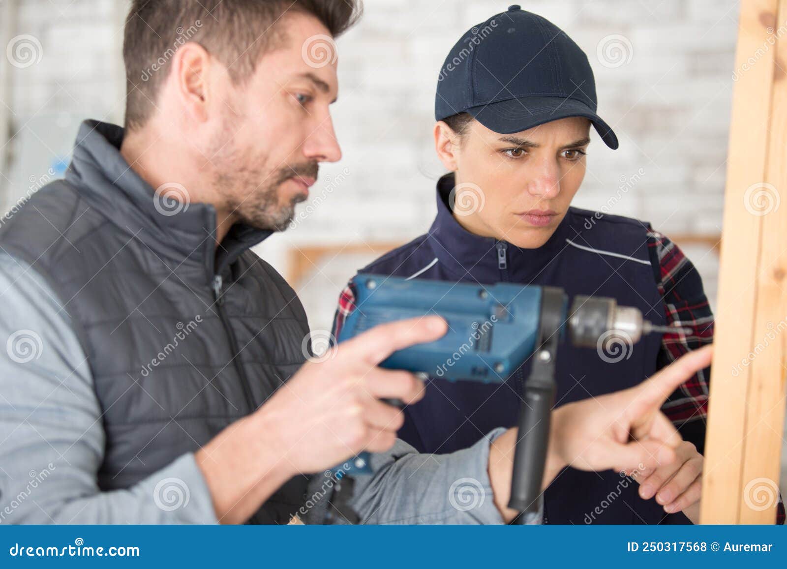 Foreman Training Apprentice Female Carpenter To Use Drill Stock Photo ...