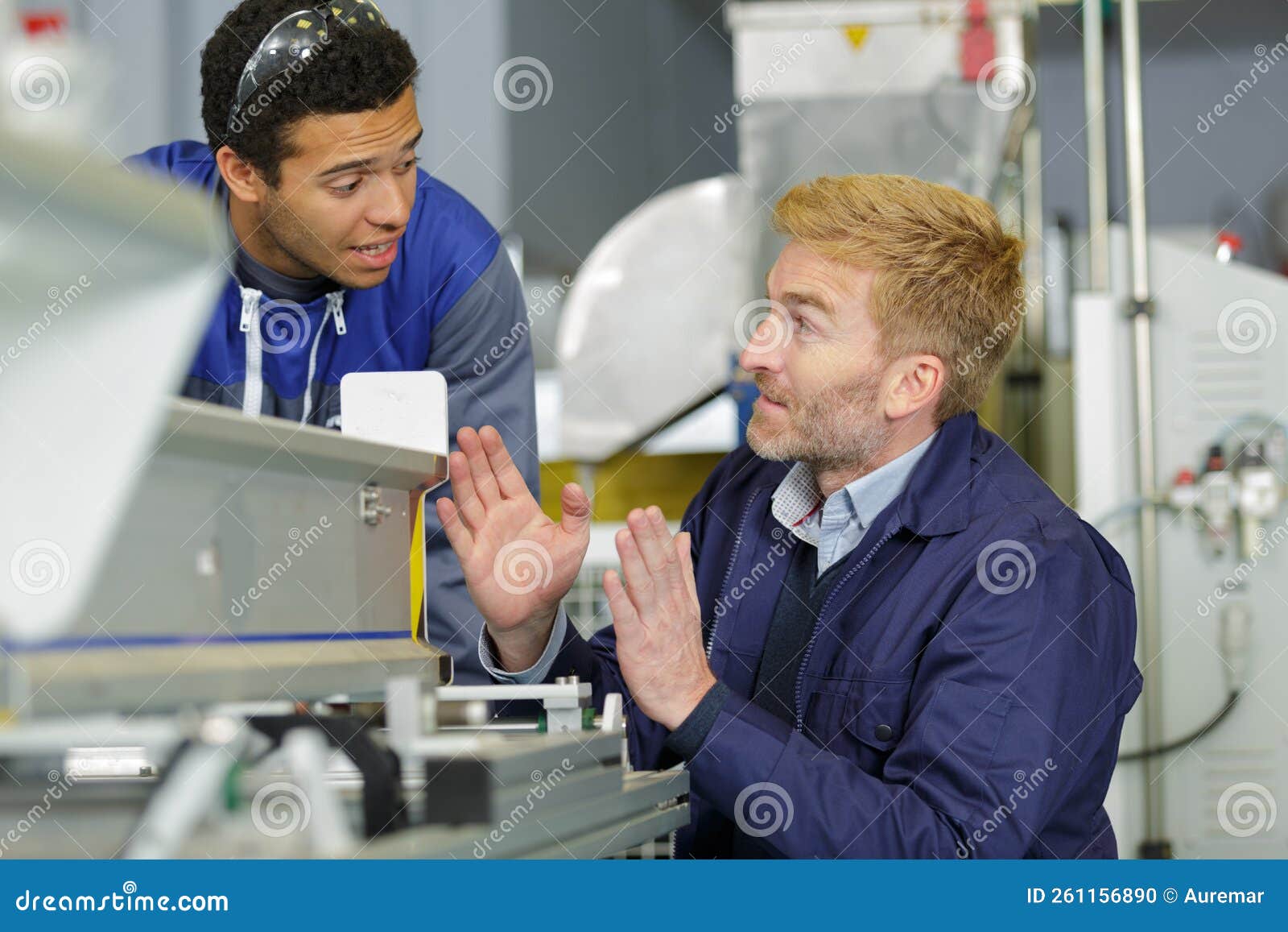 Foreman Using Hands To Show Trainee Width Needed Stock Photo - Image of ...