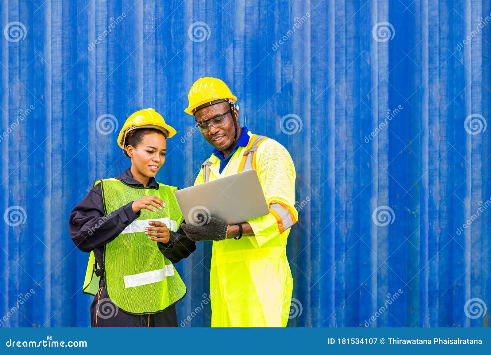Foreman Using Laptop Computer in the Port of Loading Goods. Foreman ...