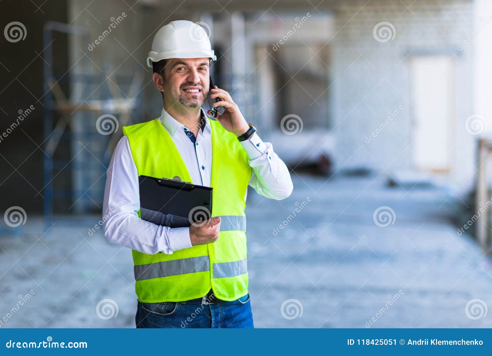Foreman in Working Uniform Expertising the Structure Standing with ...