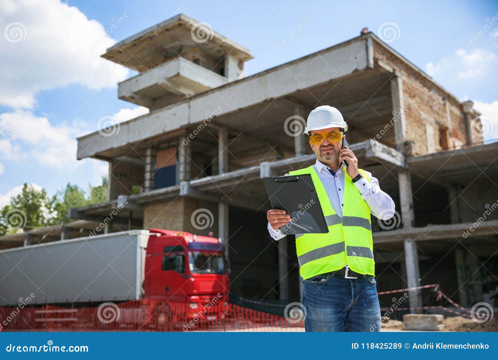 Foreman in Working Uniform Expertising the Structure Standing with ...