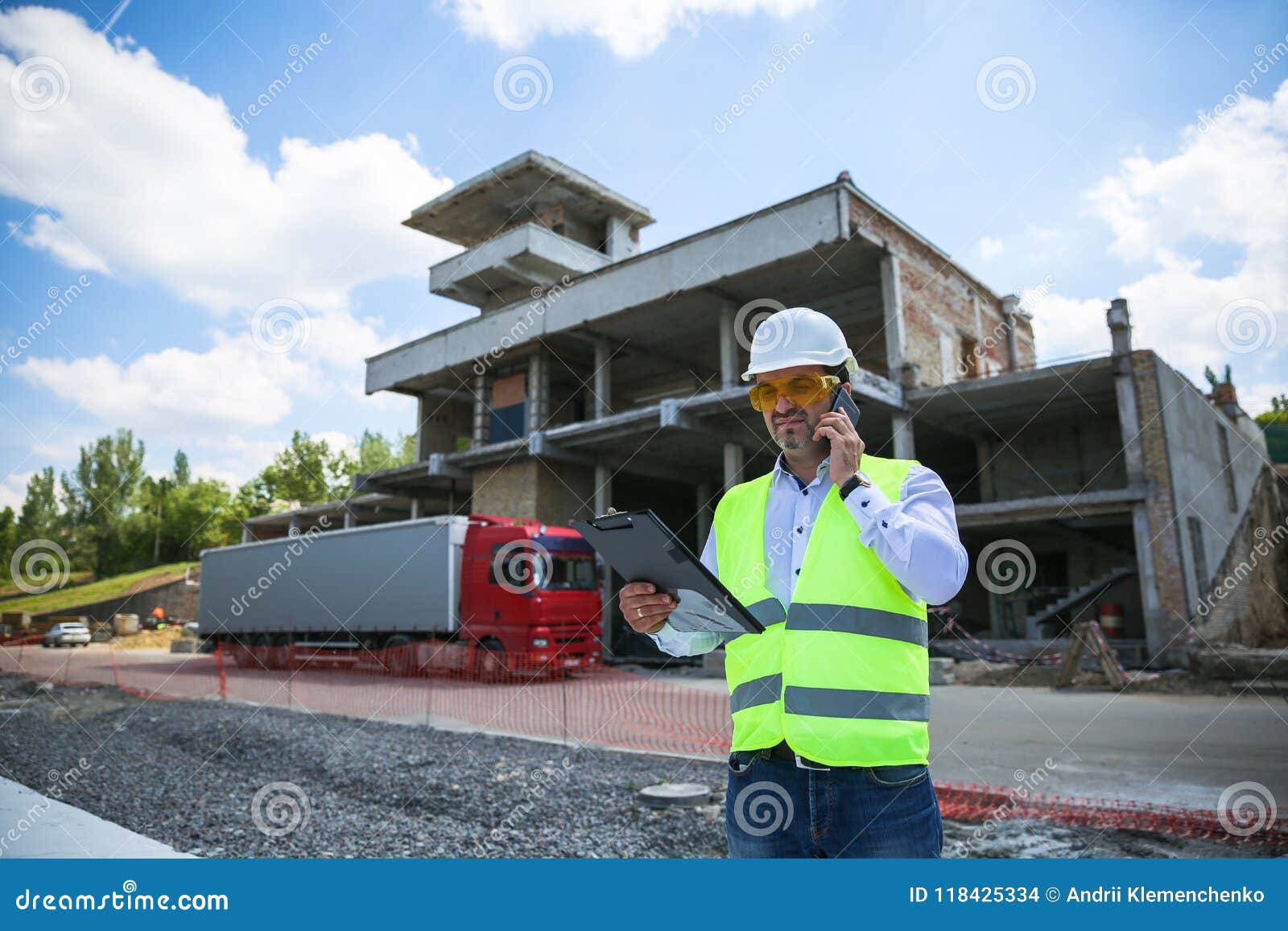 Foreman in Working Uniform Expertising the Structure Standing with ...
