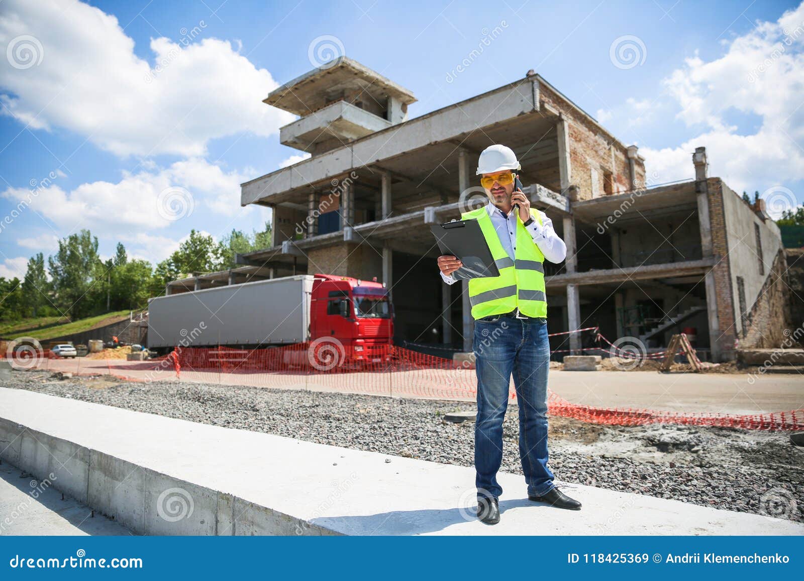 Foreman in Working Uniform Expertising the Structure Standing with ...