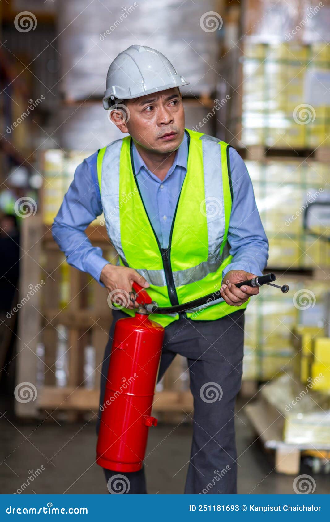 Foreman or Worker Holding a Fire Extinguisher and Ready Stop Fire in ...