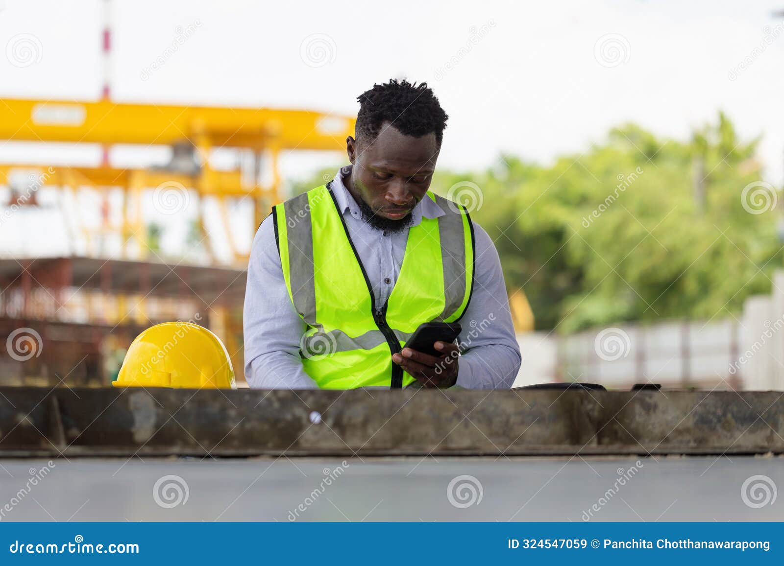 Foreman Worker Using Mobile Smartphone at the Construction Site ...