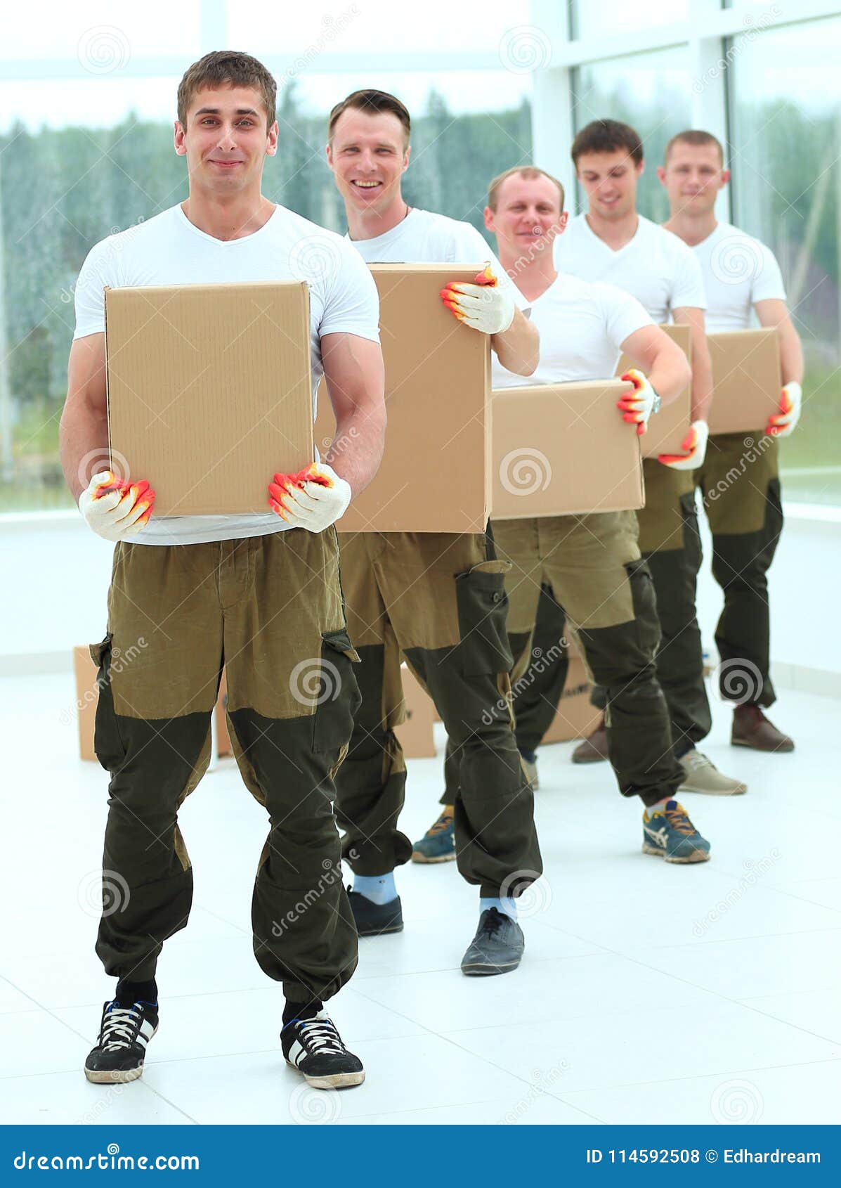 Team of Builders with Boxes of Building Materials Stock Photo - Image ...