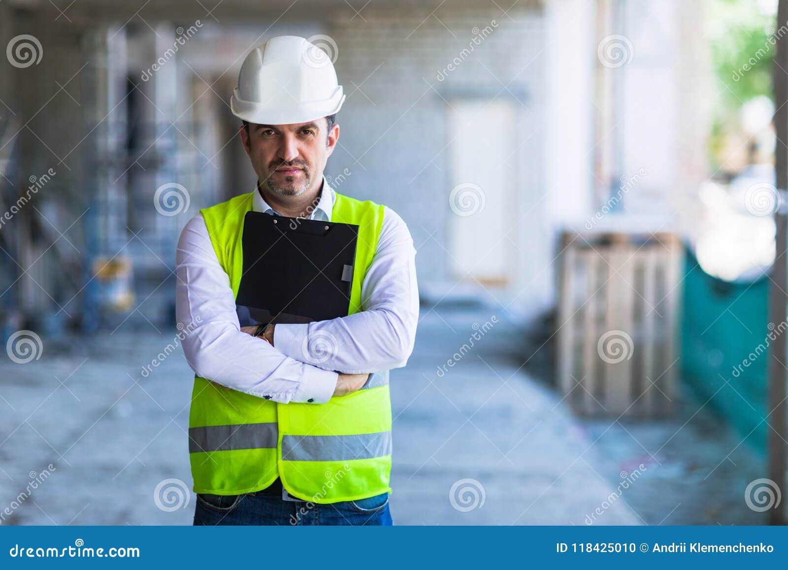 Foreman in Working Uniform Expertising the Structure Standing with ...