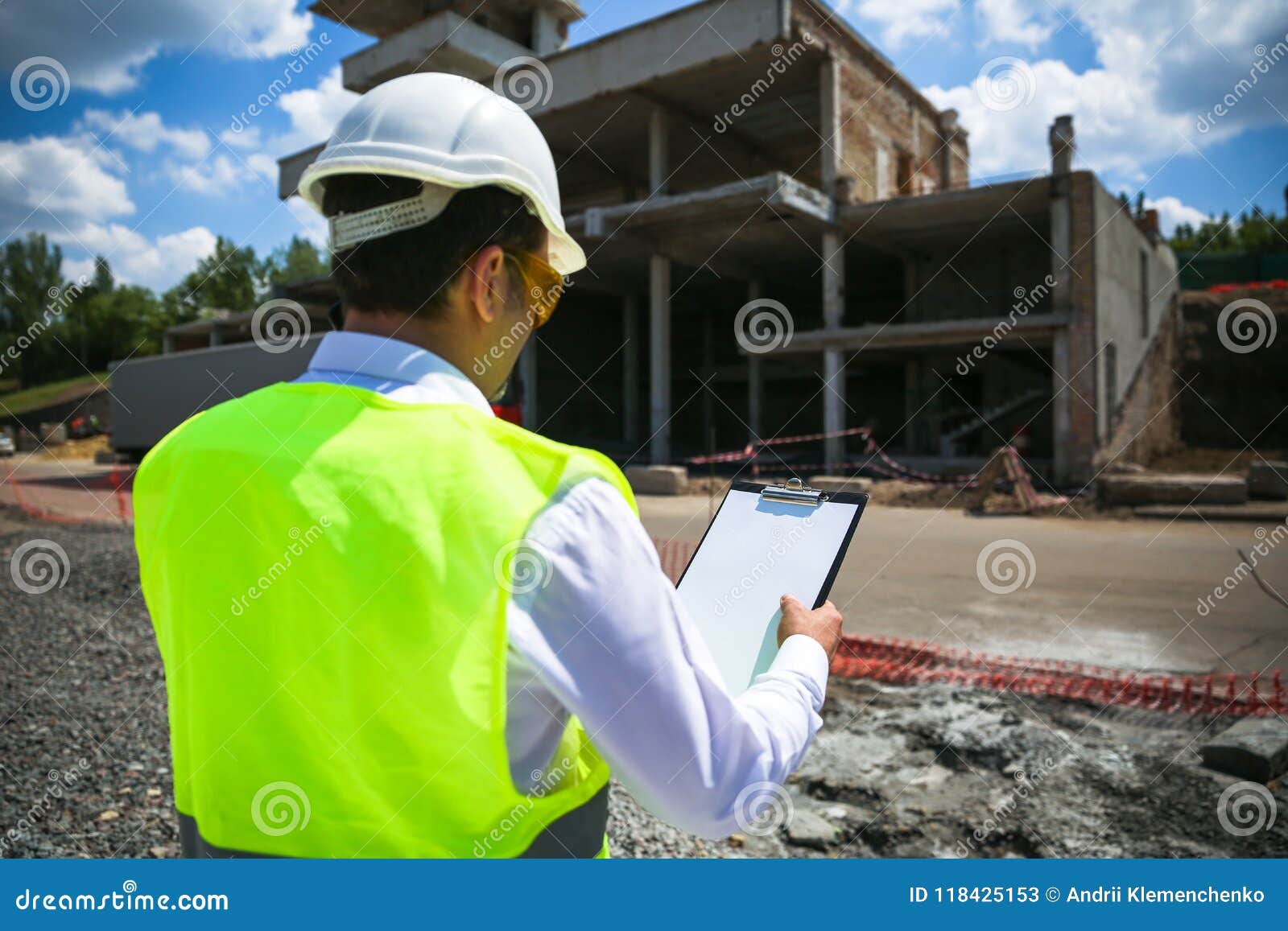 Foreman in Working Uniform Expertising the Structure Standing with ...