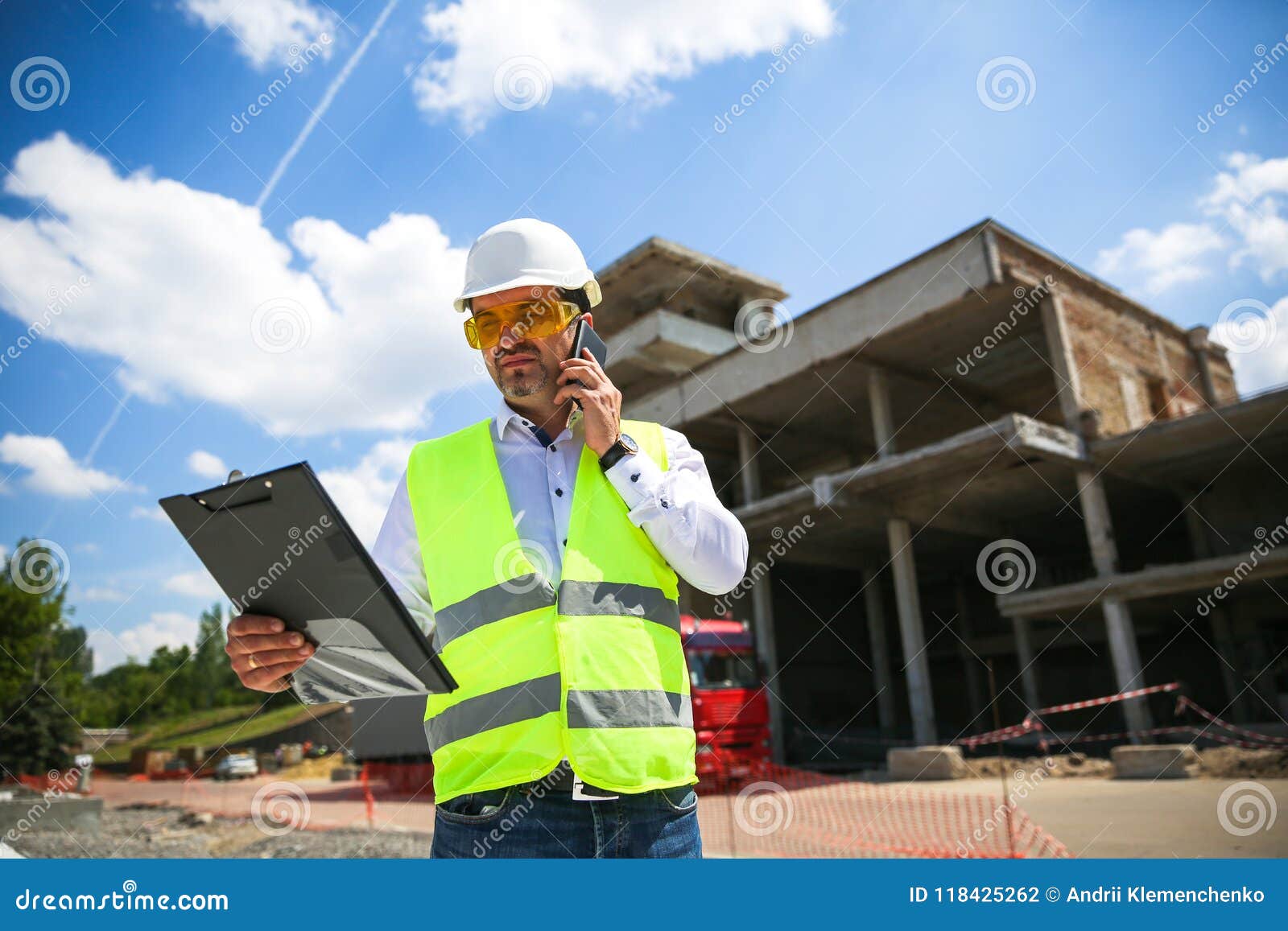 Foreman in Working Uniform Expertising the Structure Standing with ...