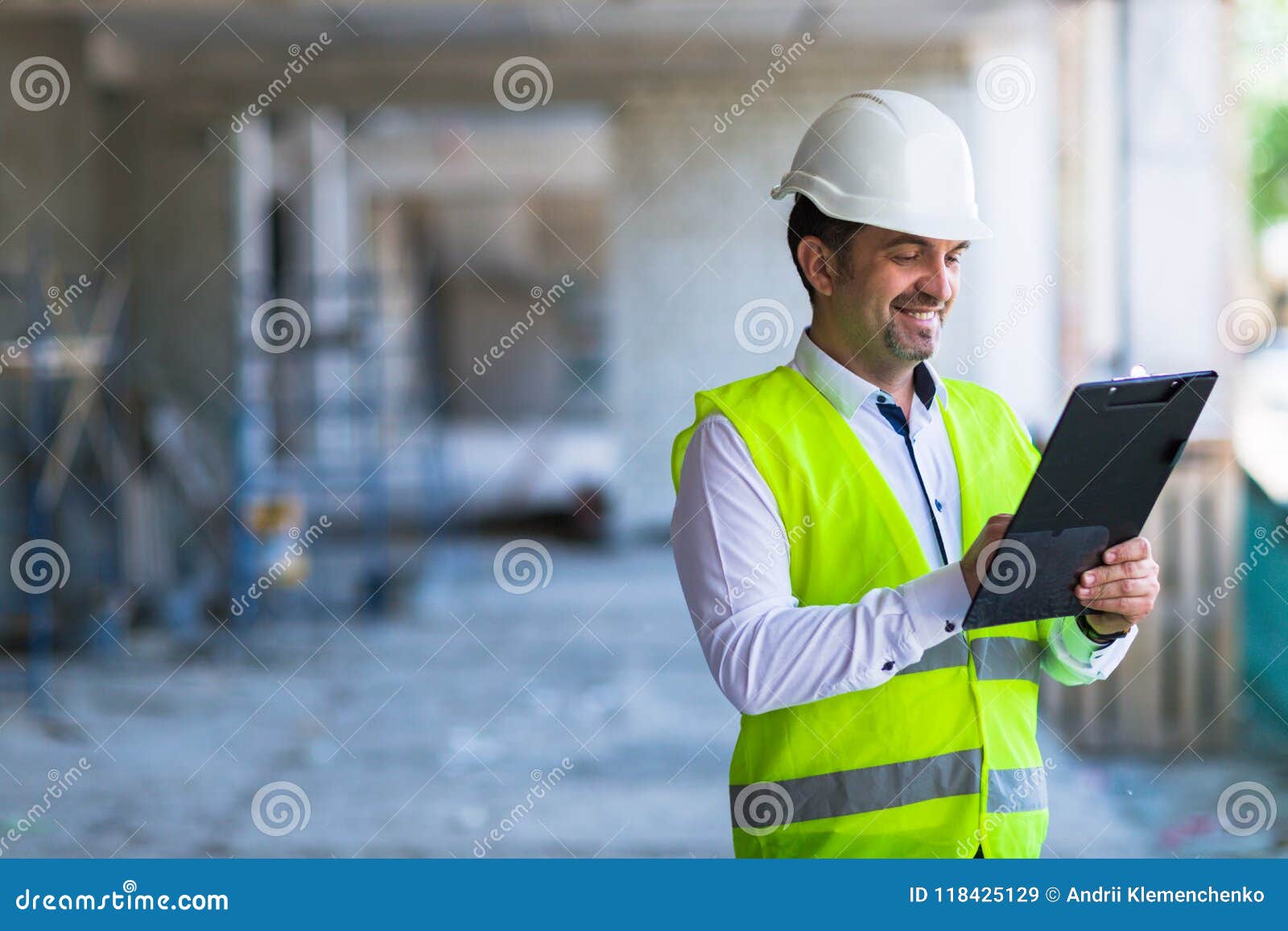 Foreman in Working Uniform Expertising the Structure Standing with ...