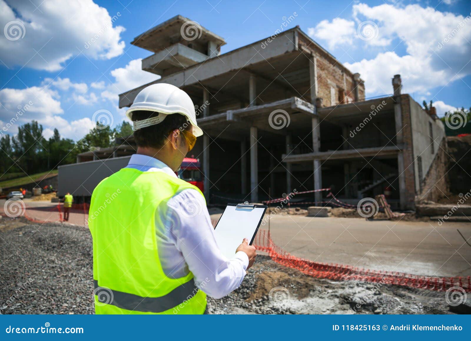 Foreman in Working Uniform Expertising the Structure Standing with ...