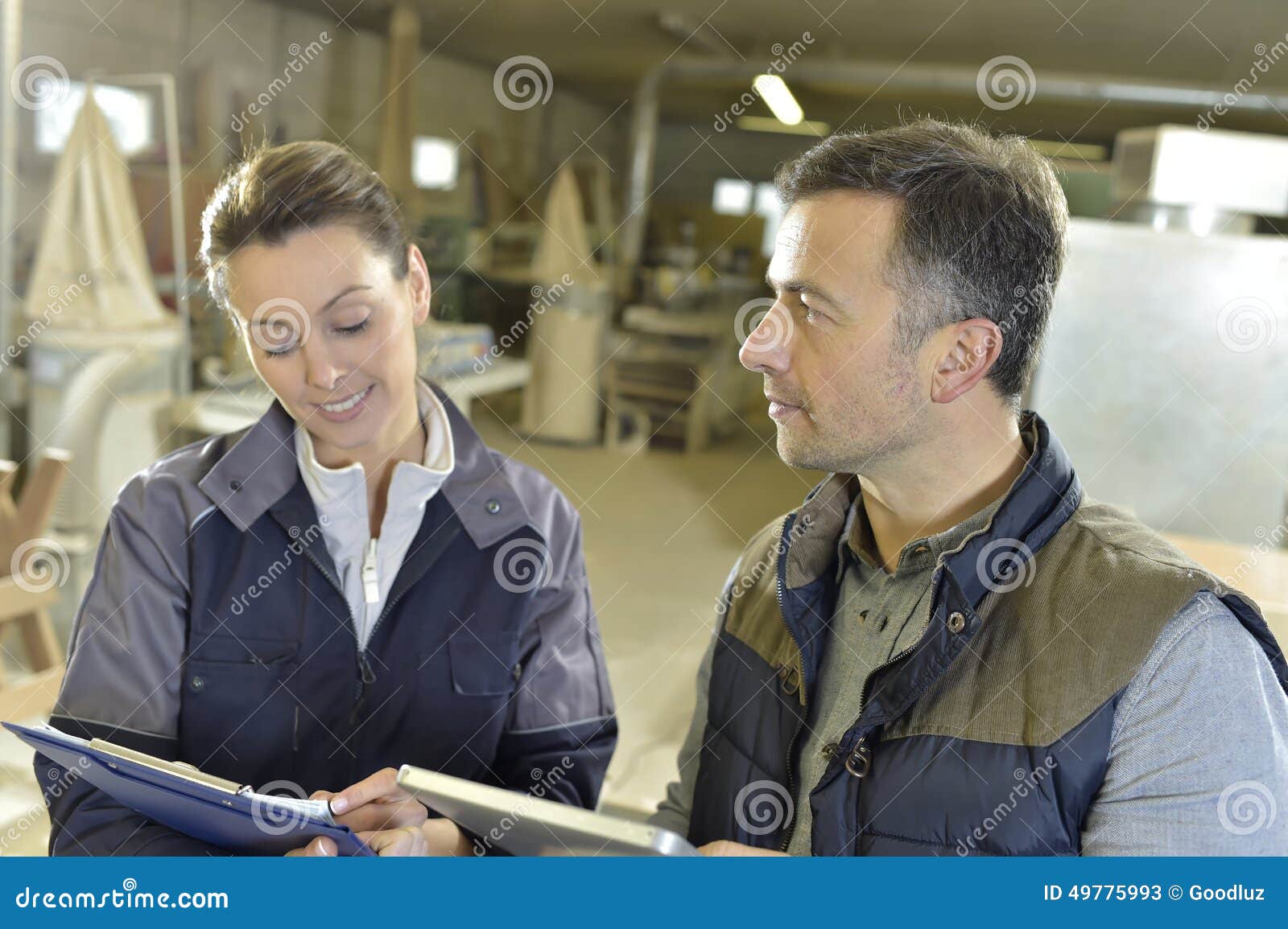 Foreman and Young Woman in Workshop Stock Image - Image of carpentry ...