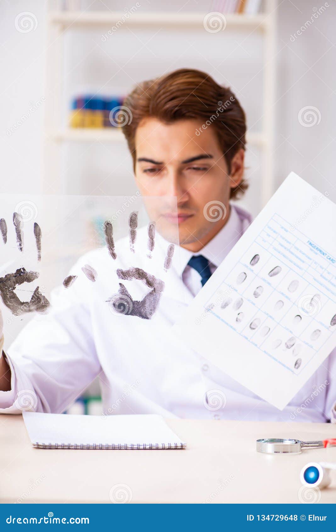 The Forensic Expert Studying Fingerprints in the Lab Stock Photo ...