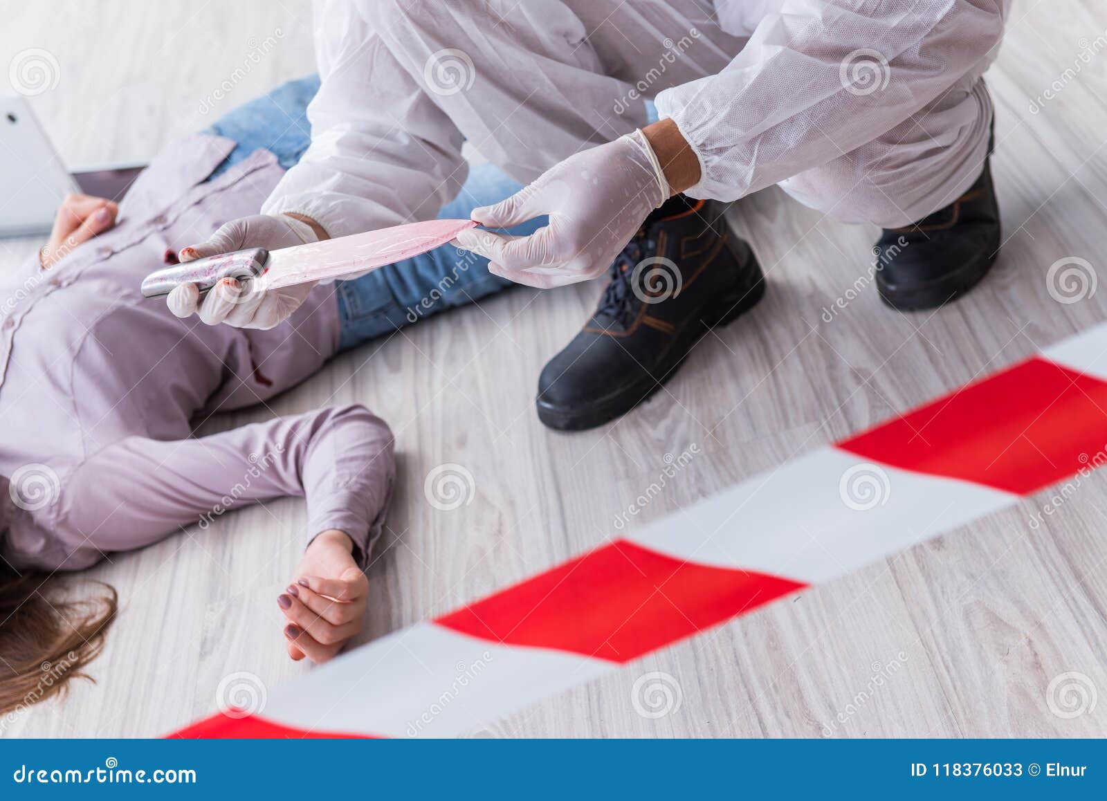 Forensic Investigator At The Crime Scene Investigating Woman Mur Stock