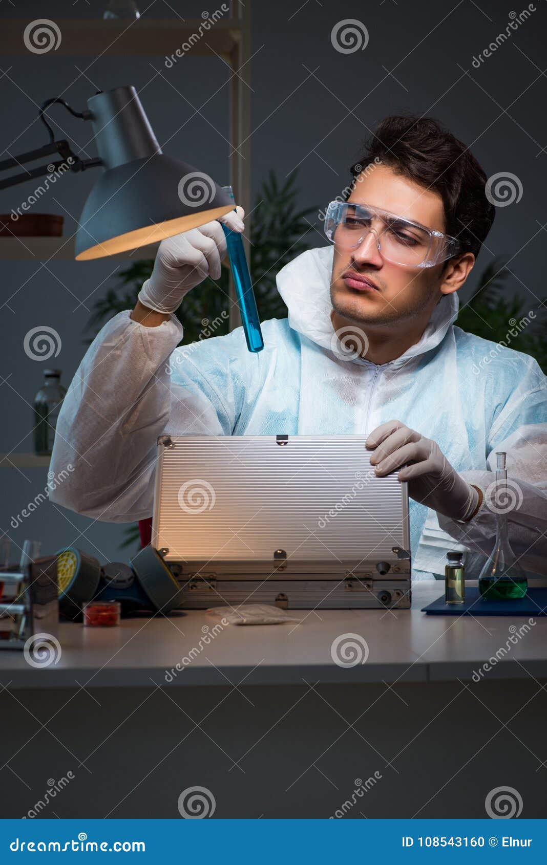 The Forensic Investigator Working in Lab Looking for Evidence Stock ...