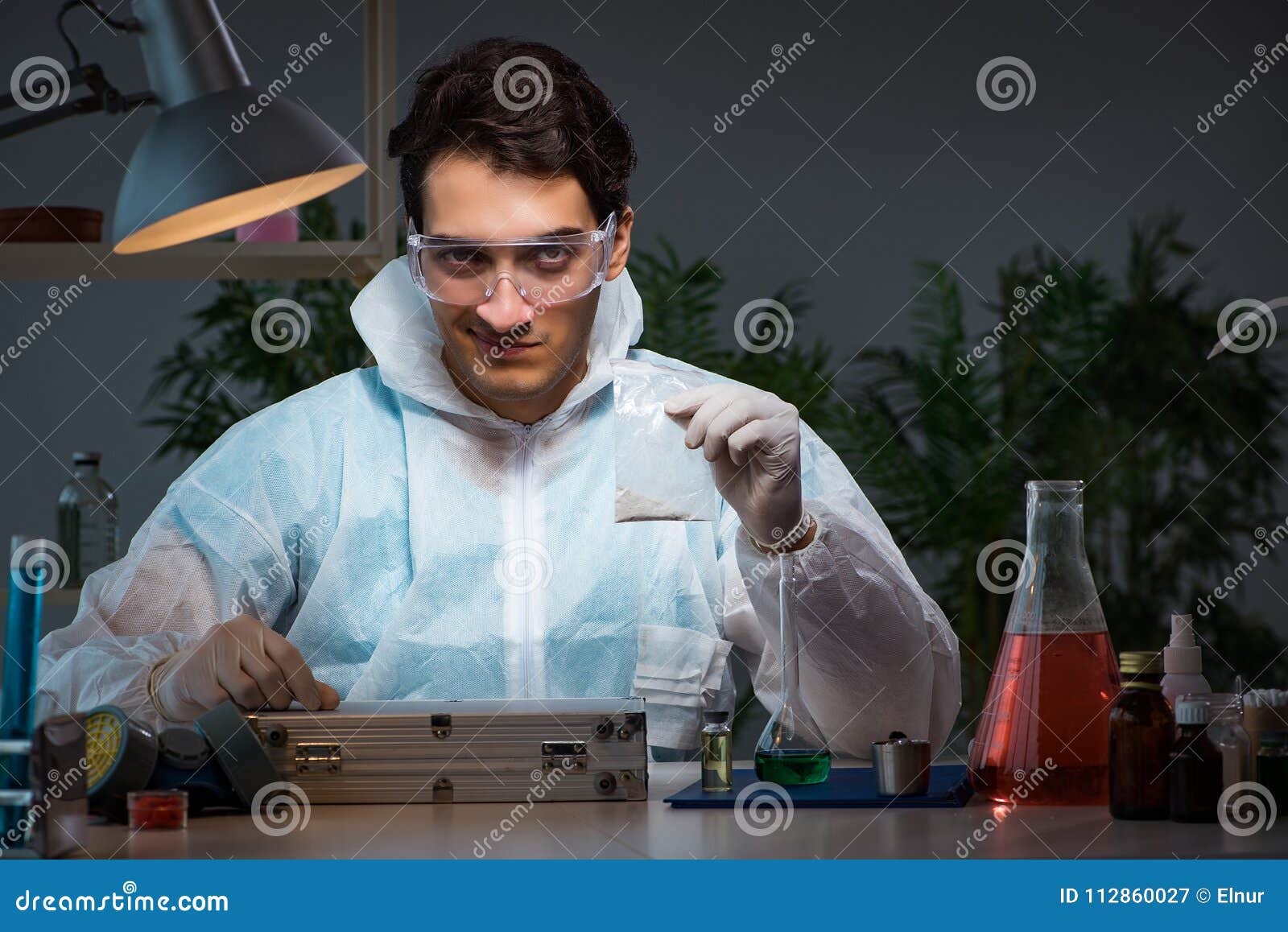 The Forensic Investigator Working in Lab Looking for Evidence Stock ...