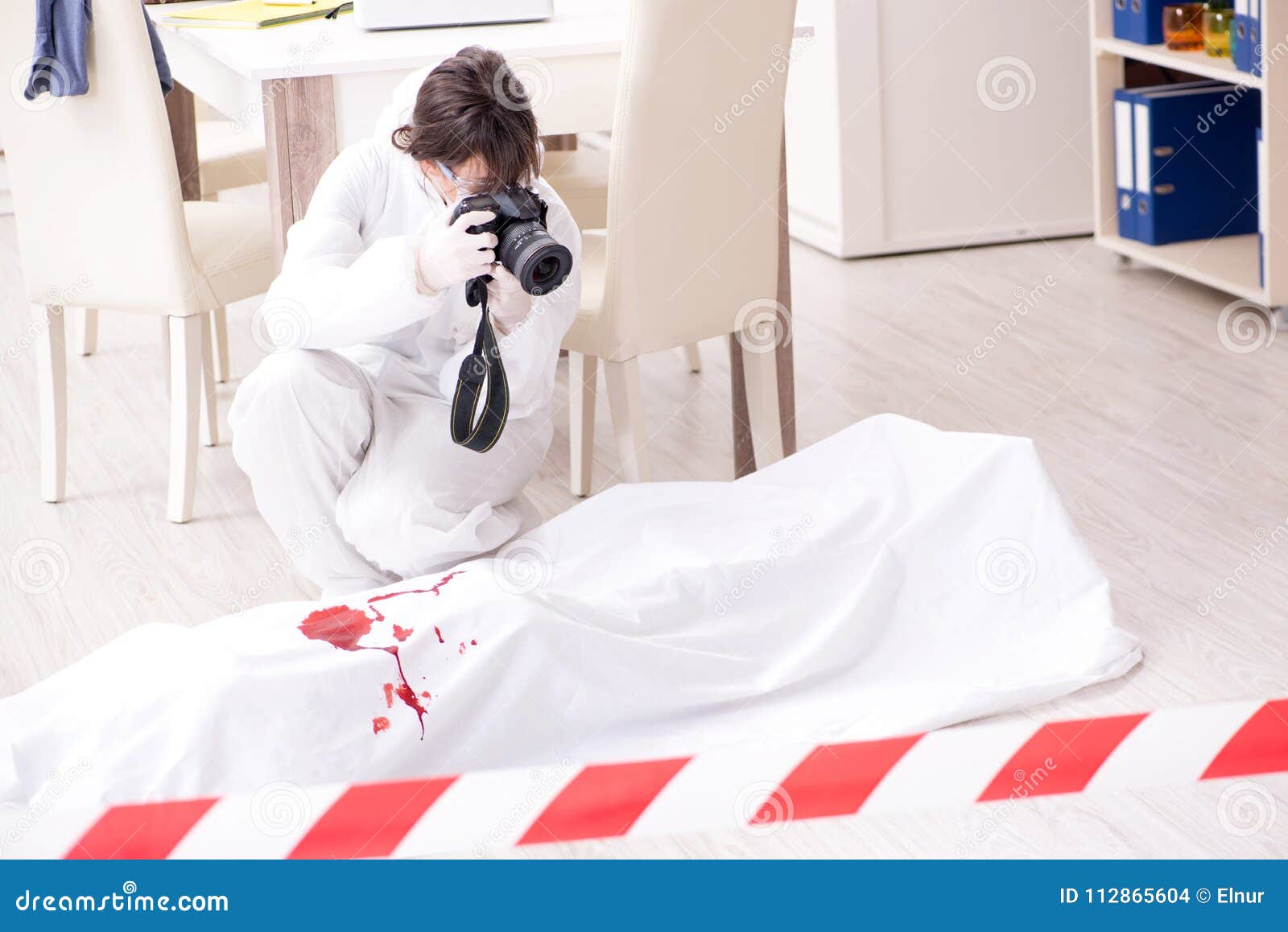 The Forensics Investigator at the Scene of Office Crime Stock Photo ...