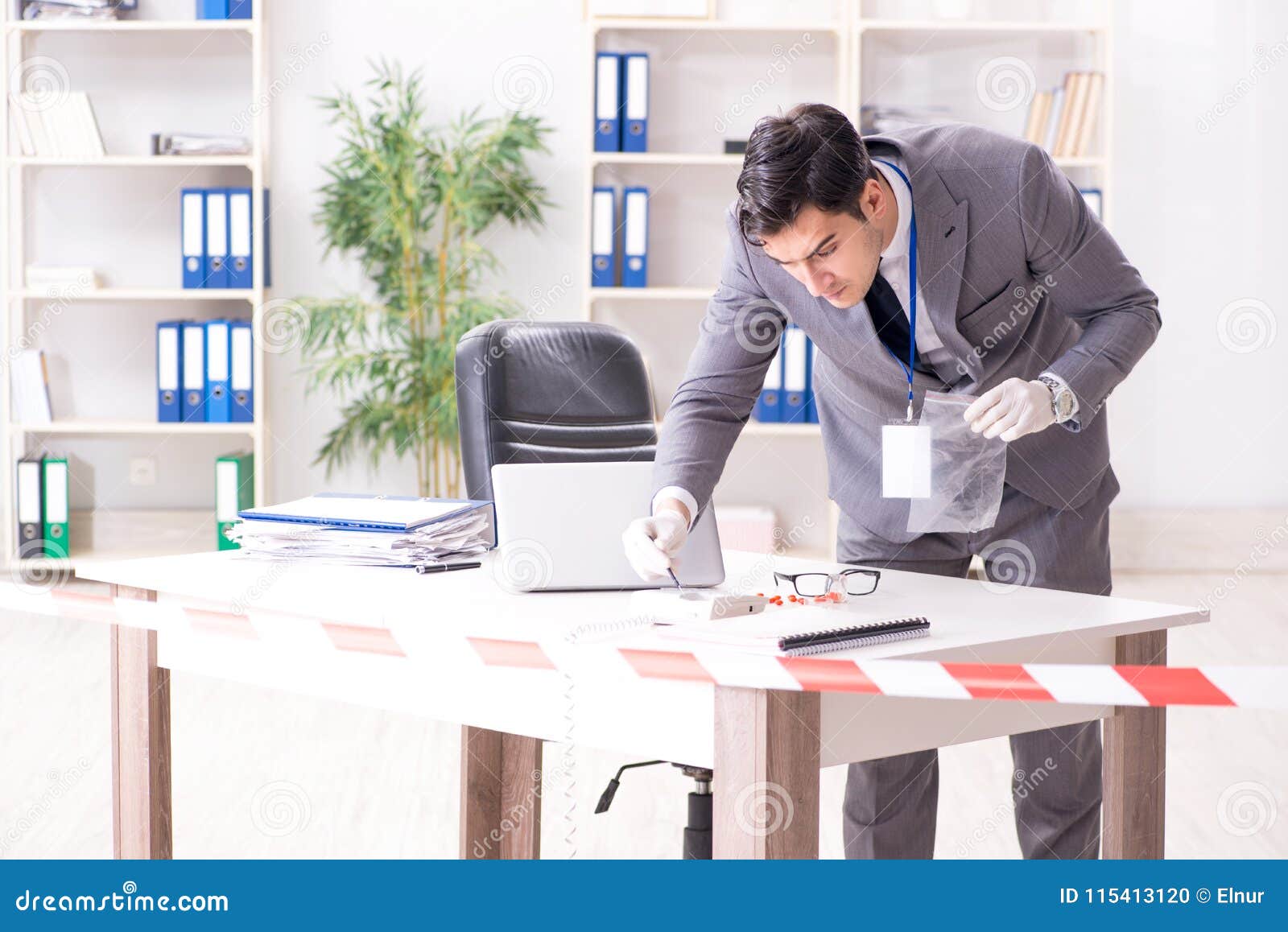 The Forensics Investigator at the Scene of Office Crime Stock Photo ...