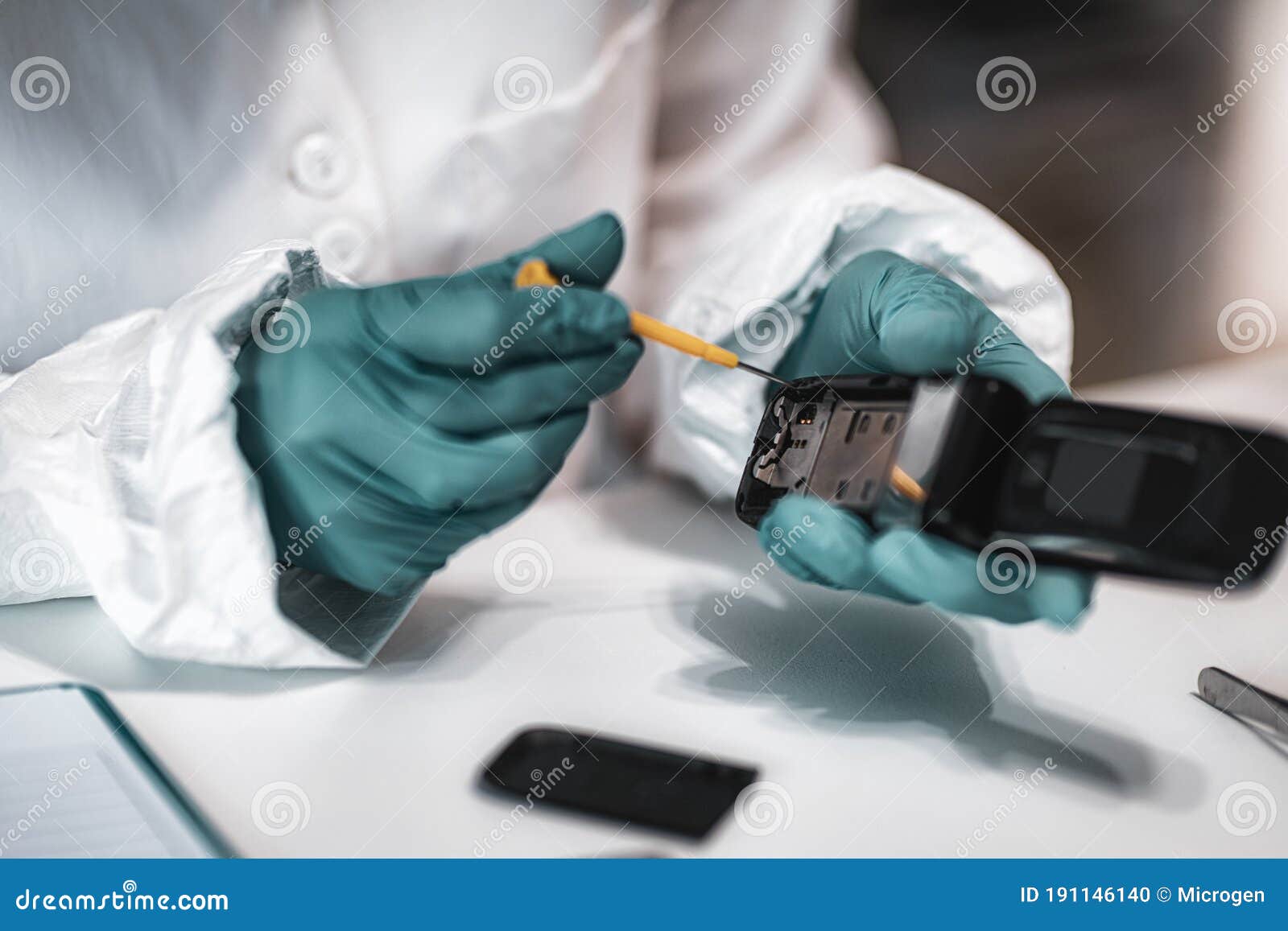 Forensics. Police Expert Examining Confiscated Mobile Phone Stock Photo ...