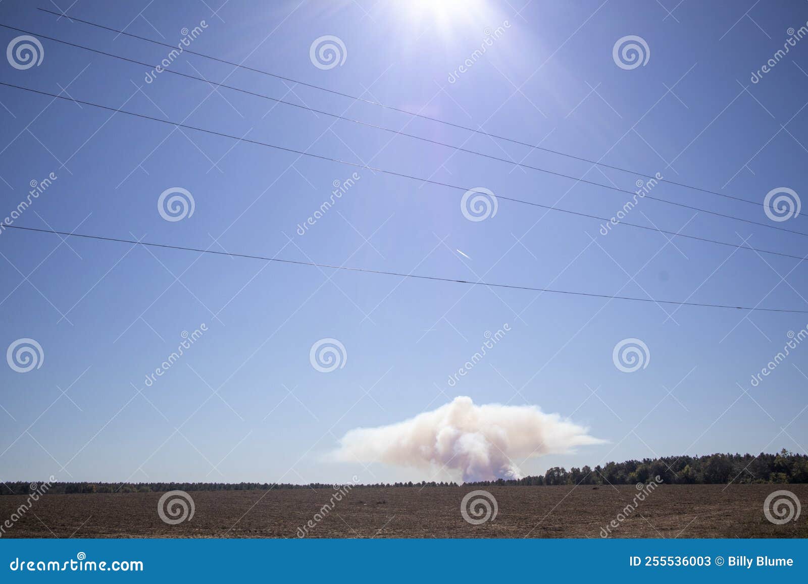 Smoke From A Distant Fire Flows Across The Horizon Against A Sunset In ...
