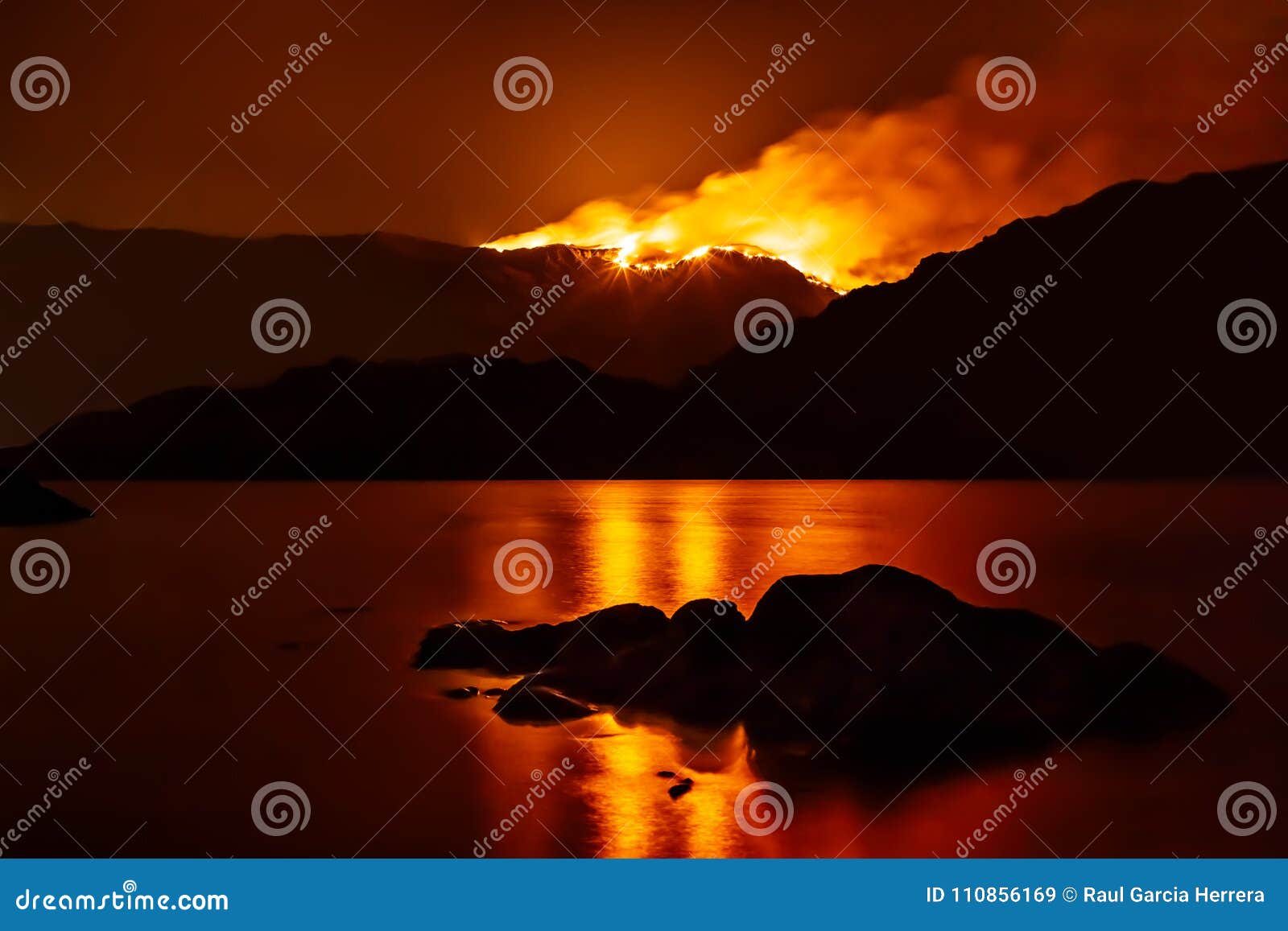 Forest Fire at Night Reflecting in Nearby Lake. Stock Image - Image of ...