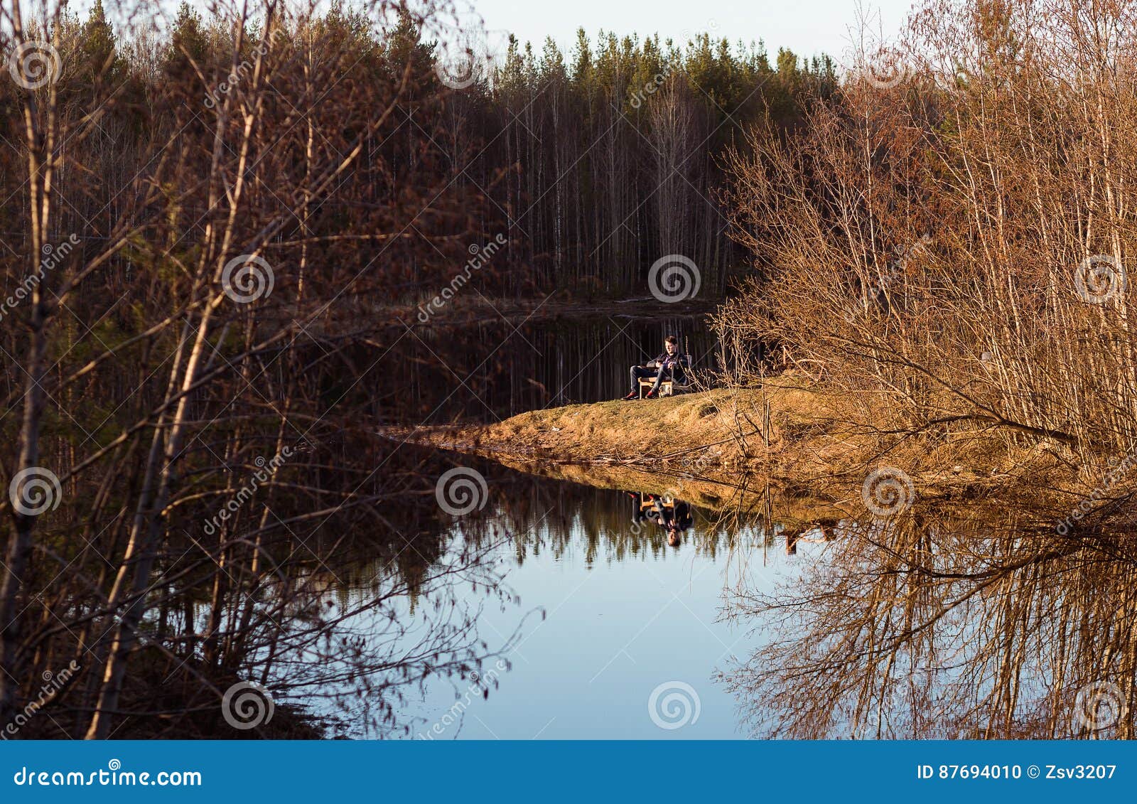 Forest Lake Landscape with Man Relaxing on Chair Stock Photo - Image of ...