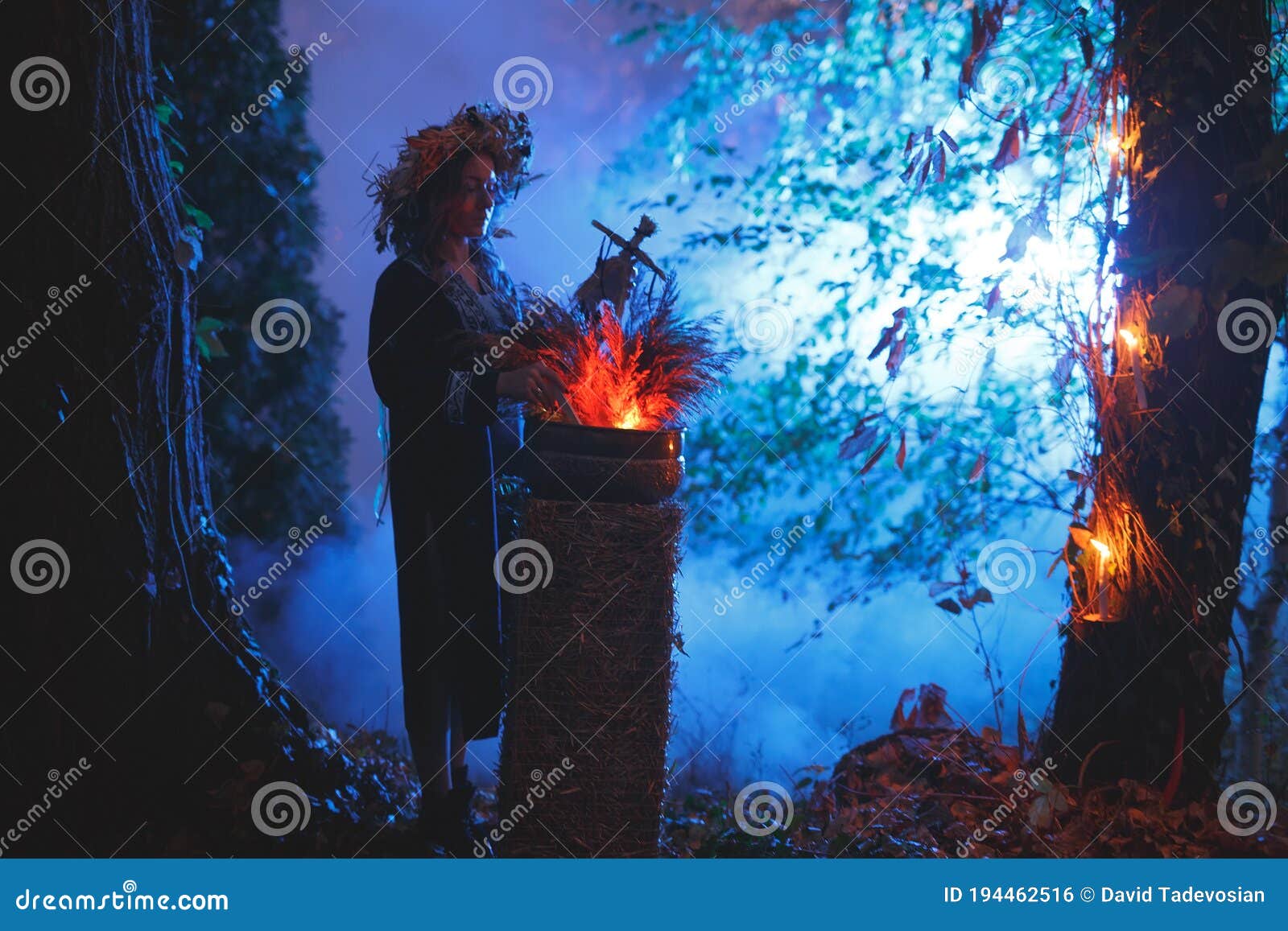 A Forest Witch Brews a Potion Holding a Voodoo Doll. Stock Photo ...
