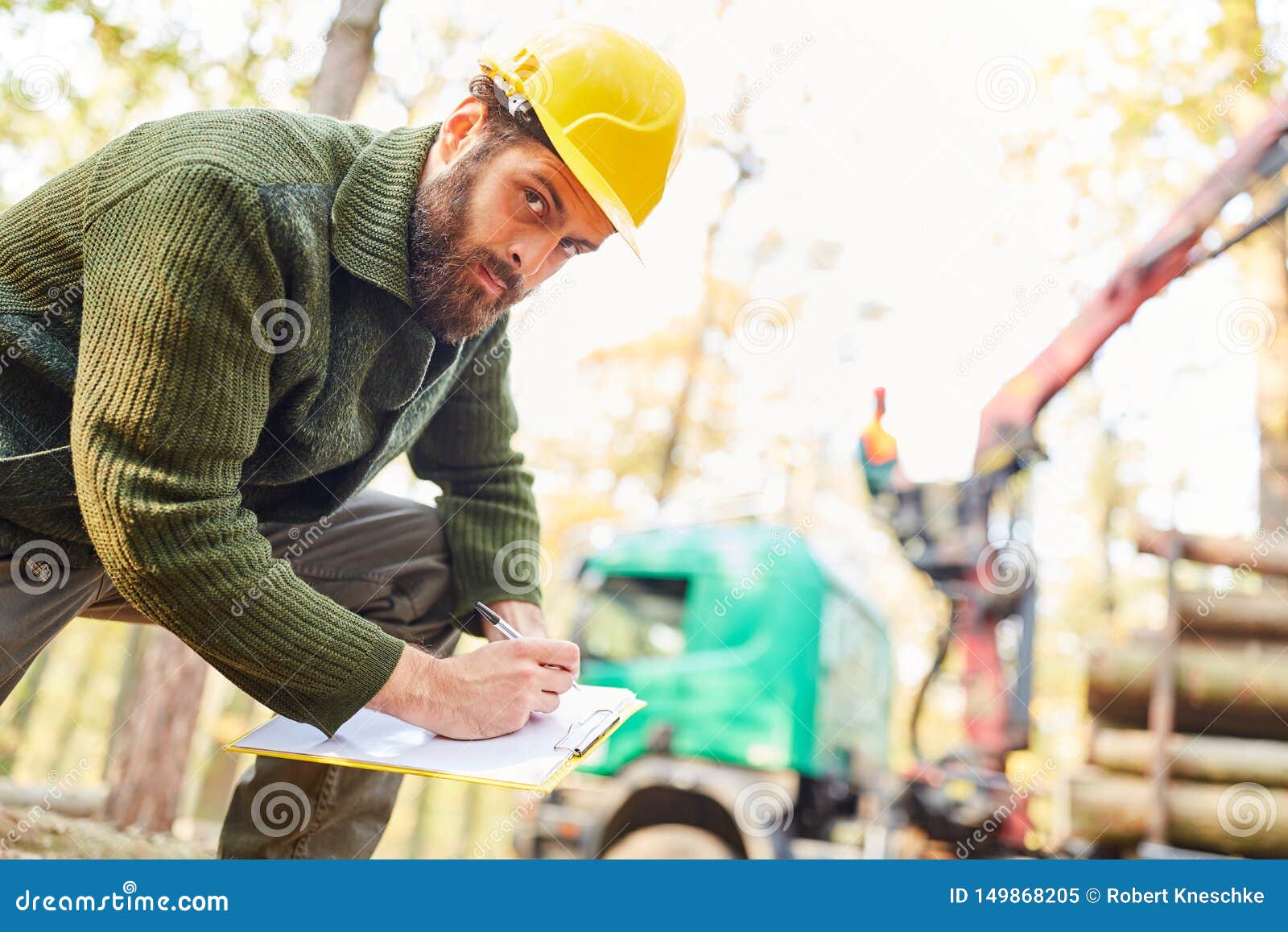 Forest Worker with Checklist while Loading Wood Stock Image - Image of ...