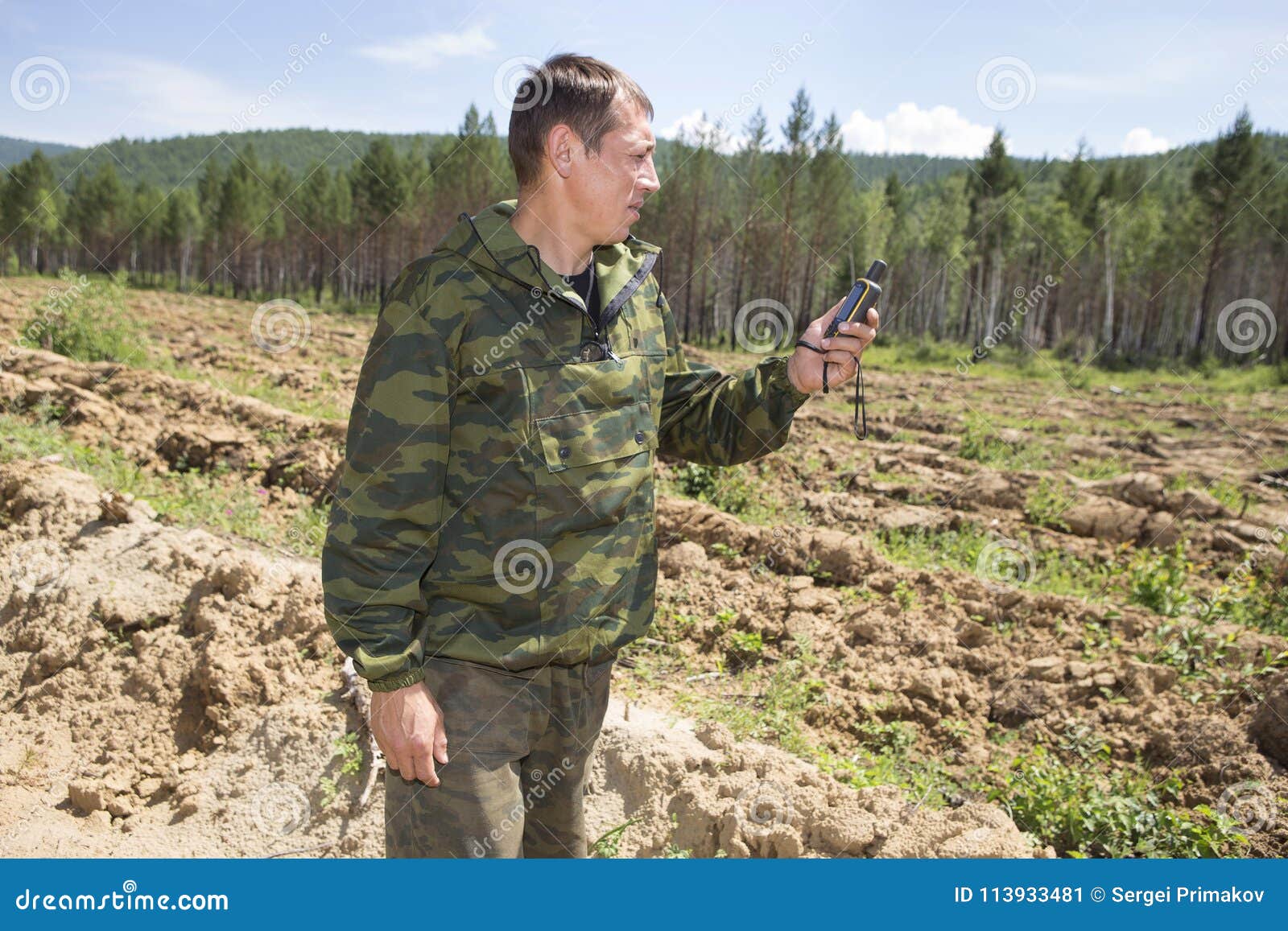 Forester Focuses on Terrain Using GPS. Stock Image - Image of planting ...