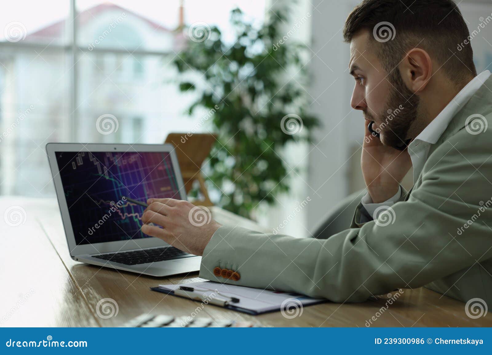 Forex Trader Talking on Phone while Working in Office Stock Photo ...