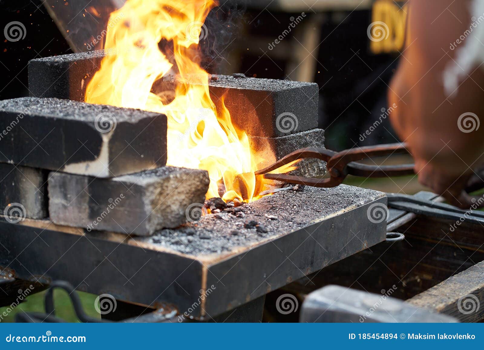 Forge, Blacksmith Forges Metal, Splinters. Blacksmith in the Forging ...