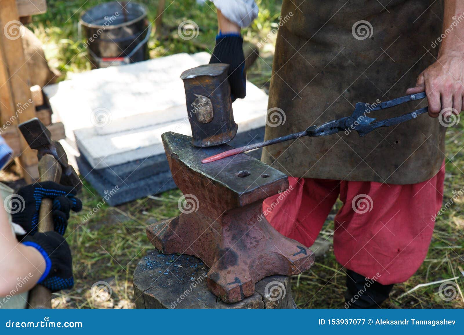 Forge. the Blacksmith Processes the Heated Metal with a Sledgehammer on ...