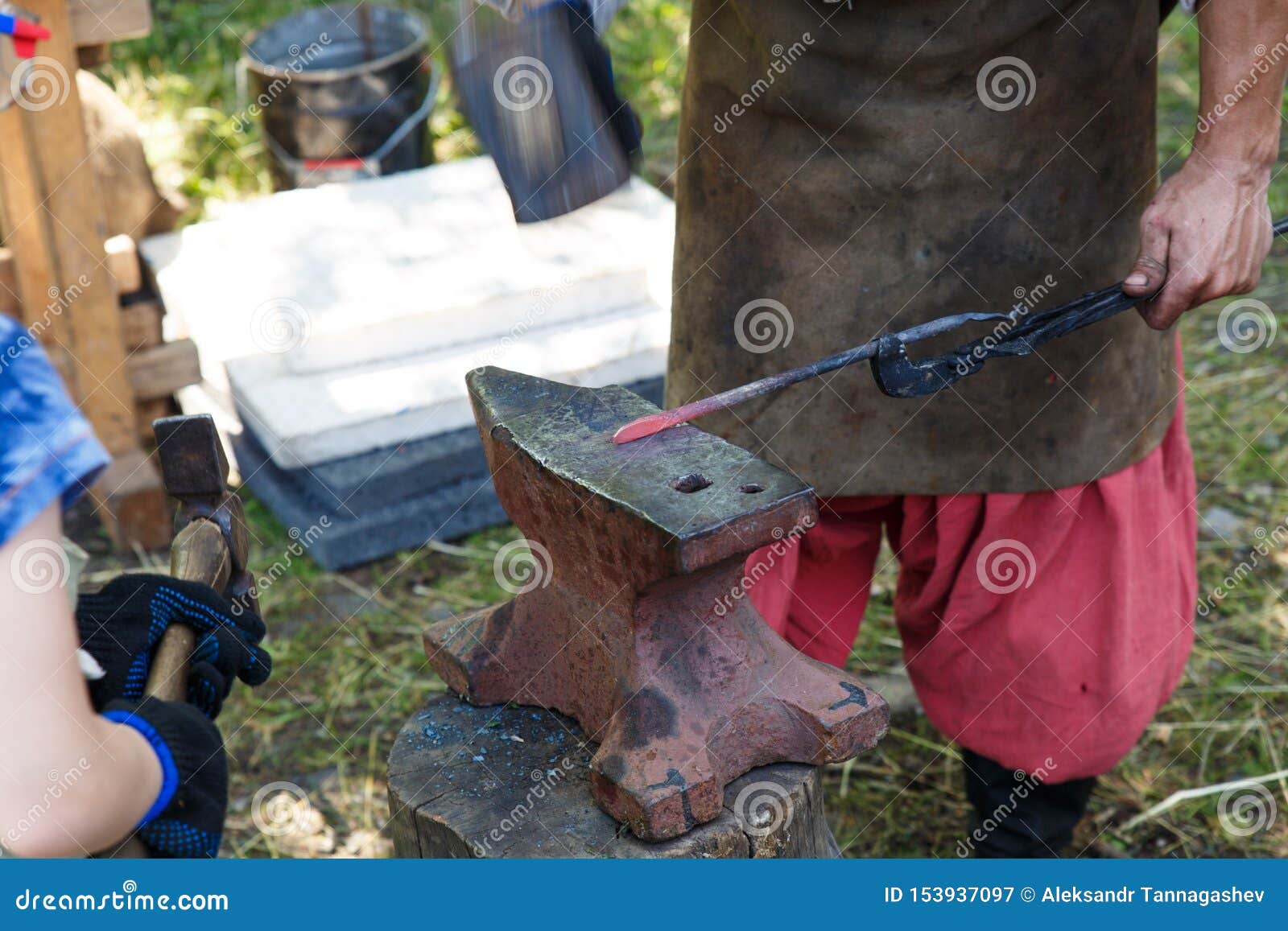 Forge. the Blacksmith Processes the Heated Metal with a Sledgehammer on ...