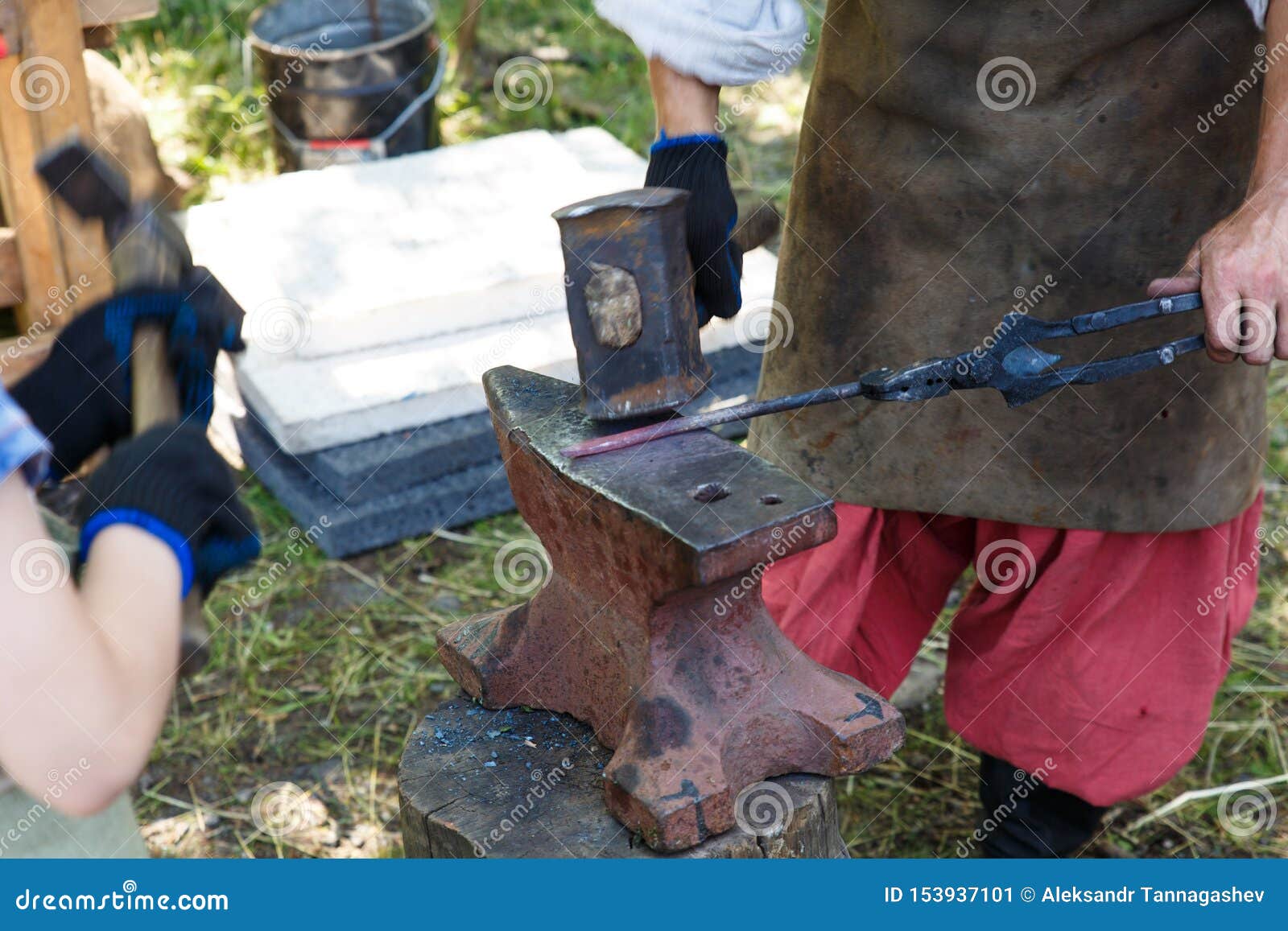 Forge. the Blacksmith Processes the Heated Metal with a Sledgehammer on ...