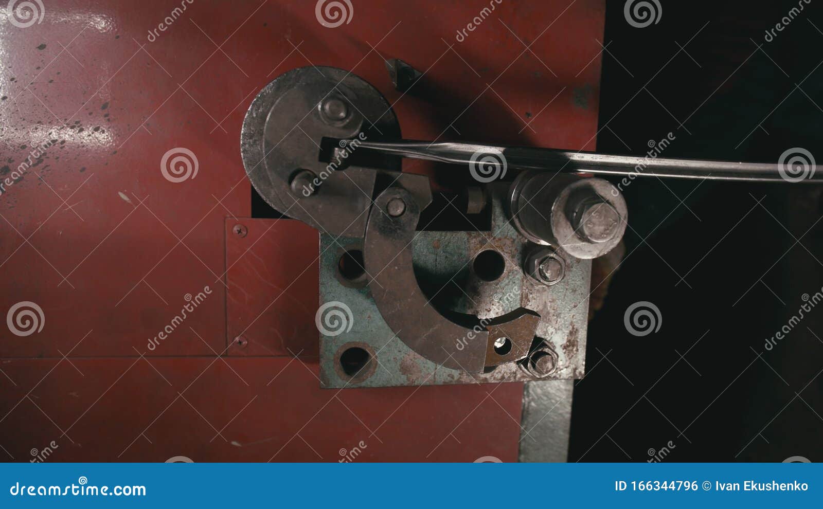 Forge Workshop on Table. Worker Bends the Metal Rod on the Wrought Iron ...