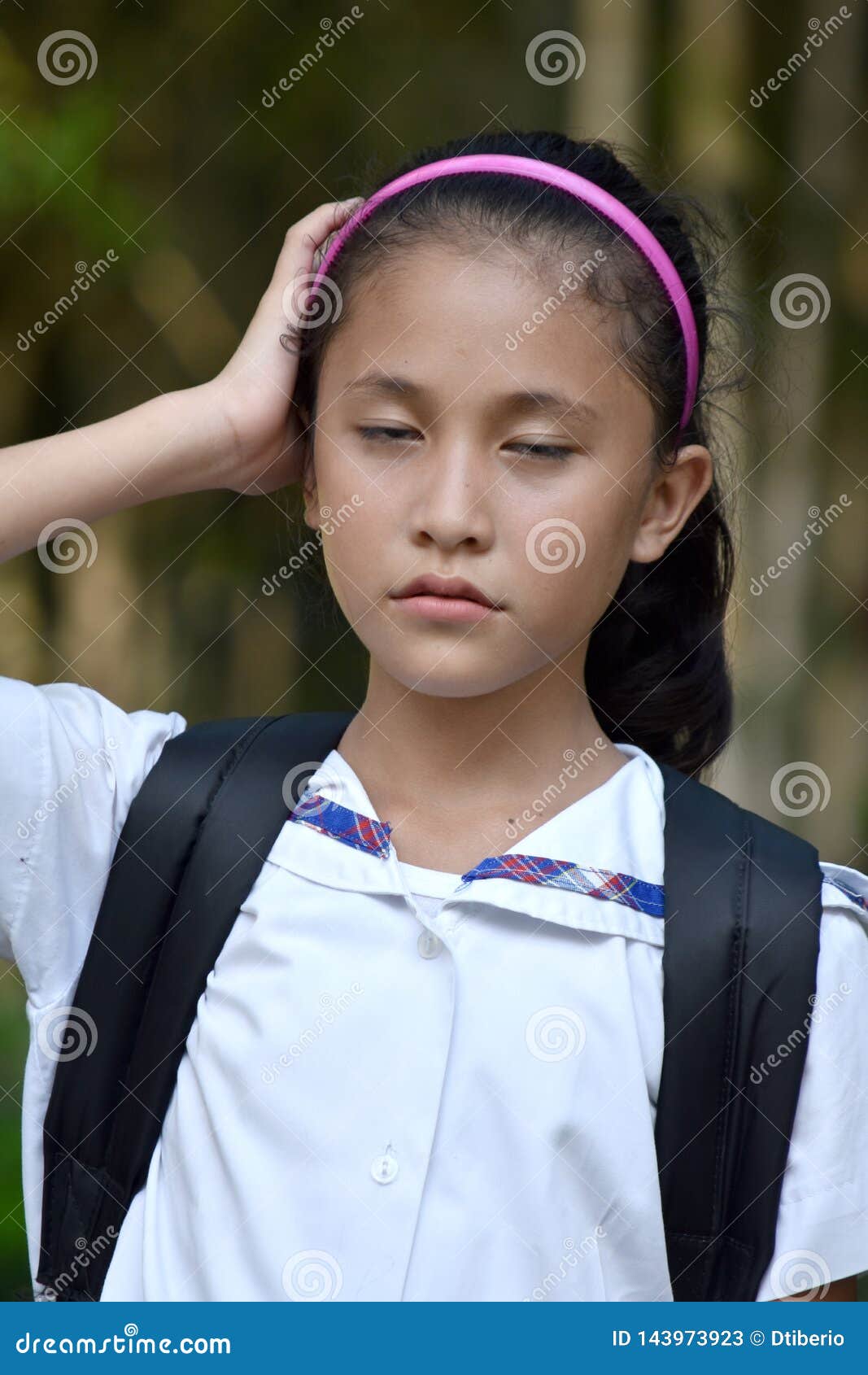 A Forgetful Female Student stock image. Image of pupil - 143973923