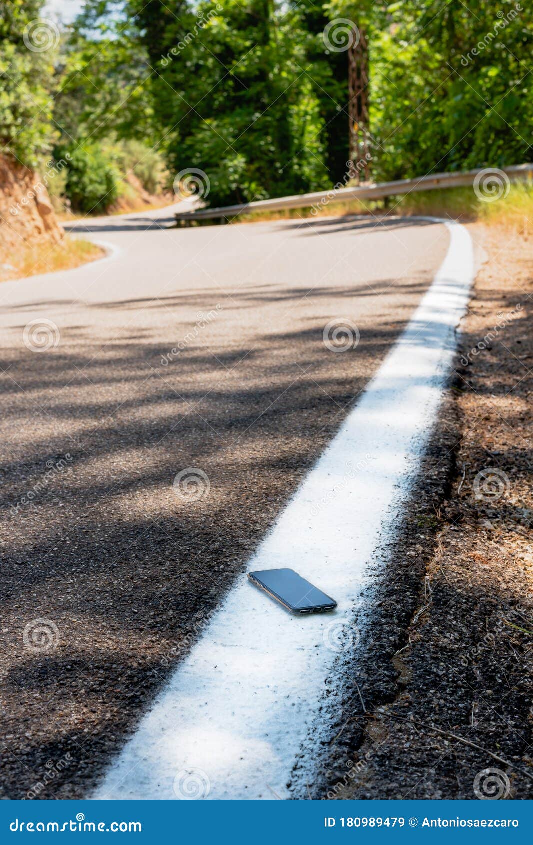 Forgotten or Lost Smartphone on the Roadside on the White Line Stock ...