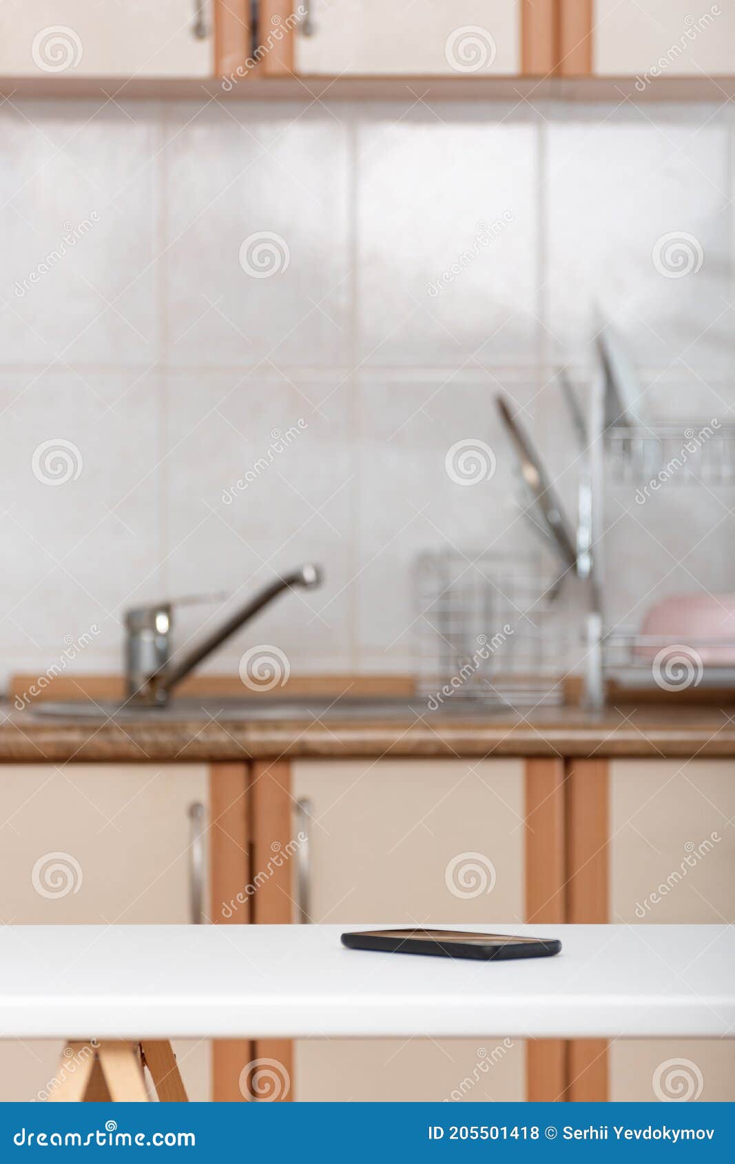 Forgotten Smartphone on Kitchen Table. Mobile Phone on the Kitchen ...