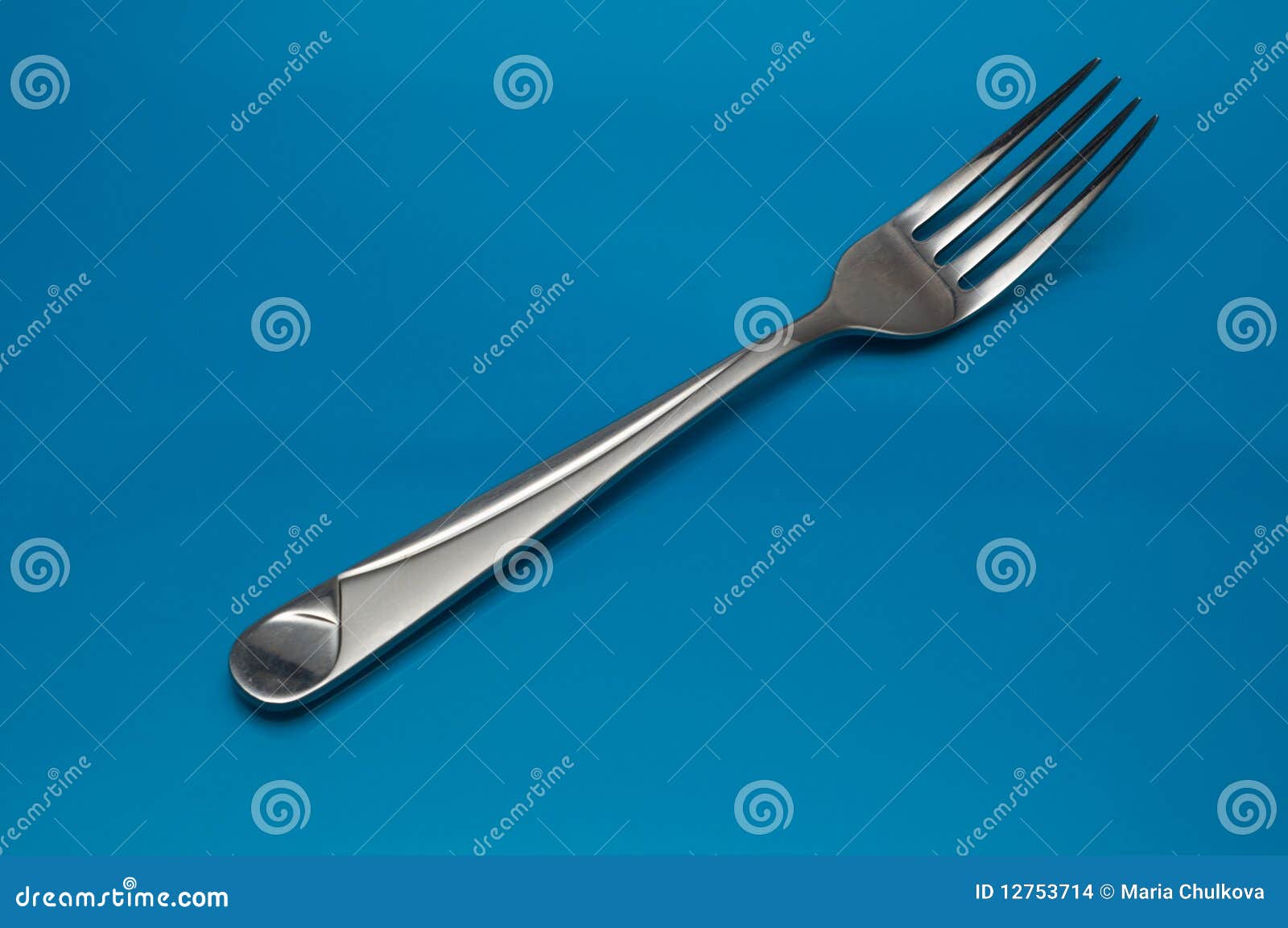 Fork on a blue background stock photo. Image of meal - 12753714