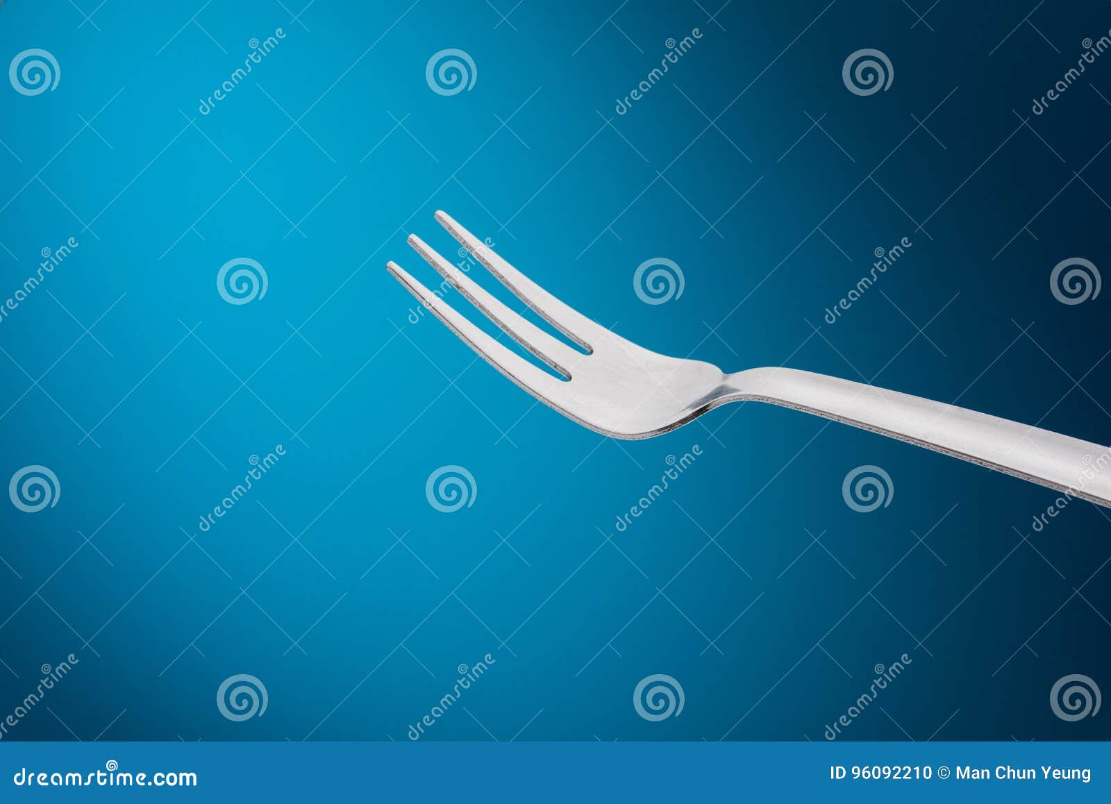 Fork in Blue Background in Studio Stock Photo - Image of empty, front ...