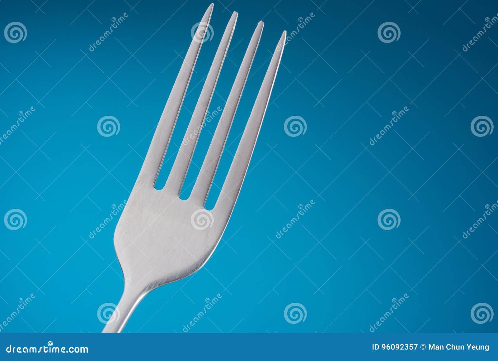 Fork in Blue Background in Studio Stock Image - Image of dark ...