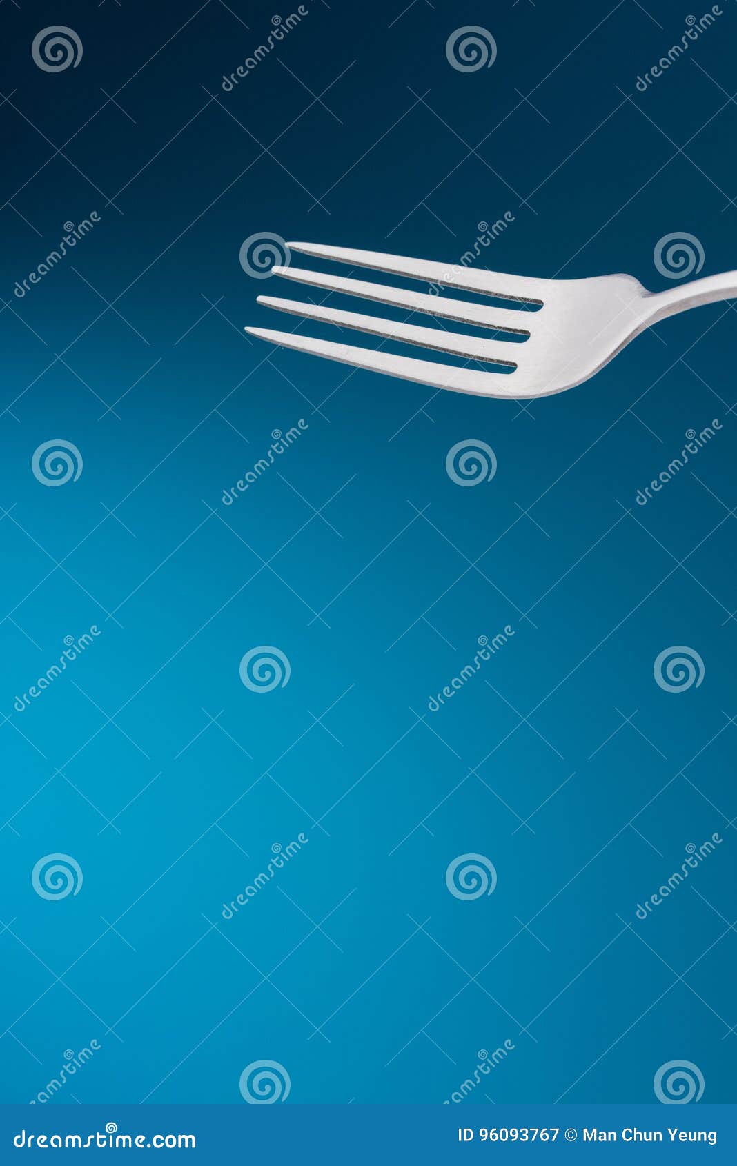 Fork in blue background stock image. Image of light, design - 96093767