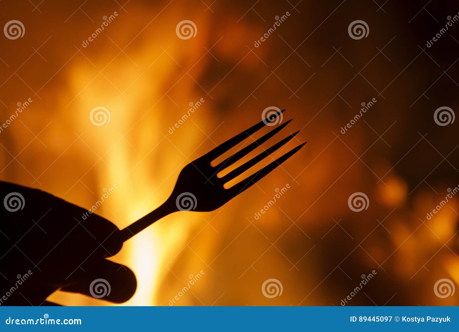 Fork in Hand Against a Background of Fire Stock Image - Image of ...