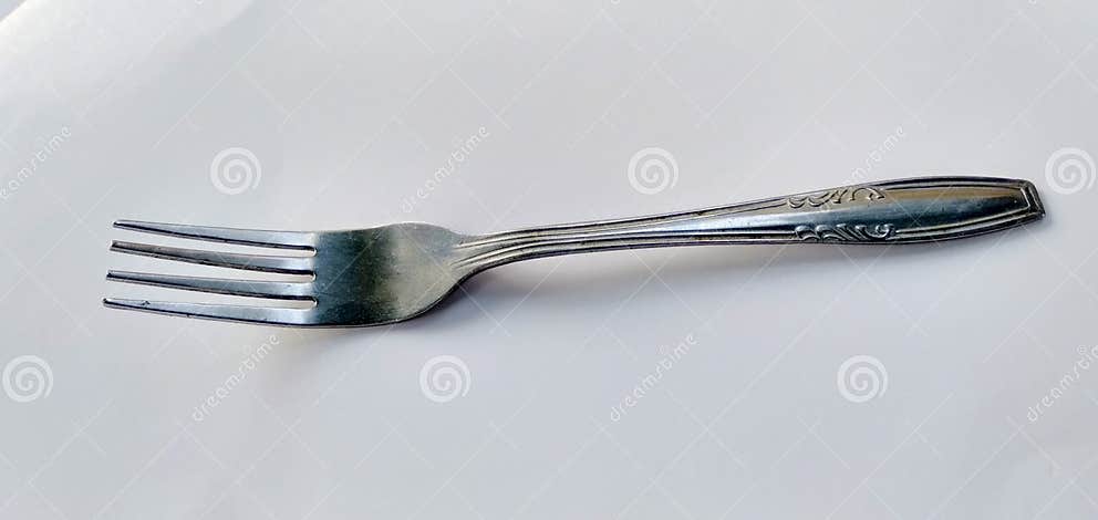 A Fork is a Kitchen Utensil that Consists of a Handle with Several Thin ...