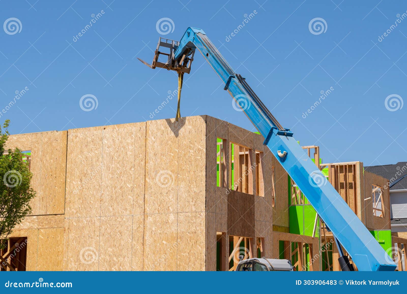 Fork Lift on the Construction of a Plywood House Stock Image - Image of ...