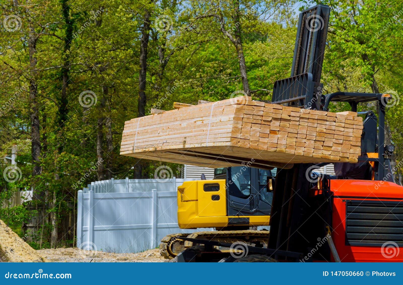 Fork Lifter Carry Construction Material Beam Framework at the Building ...